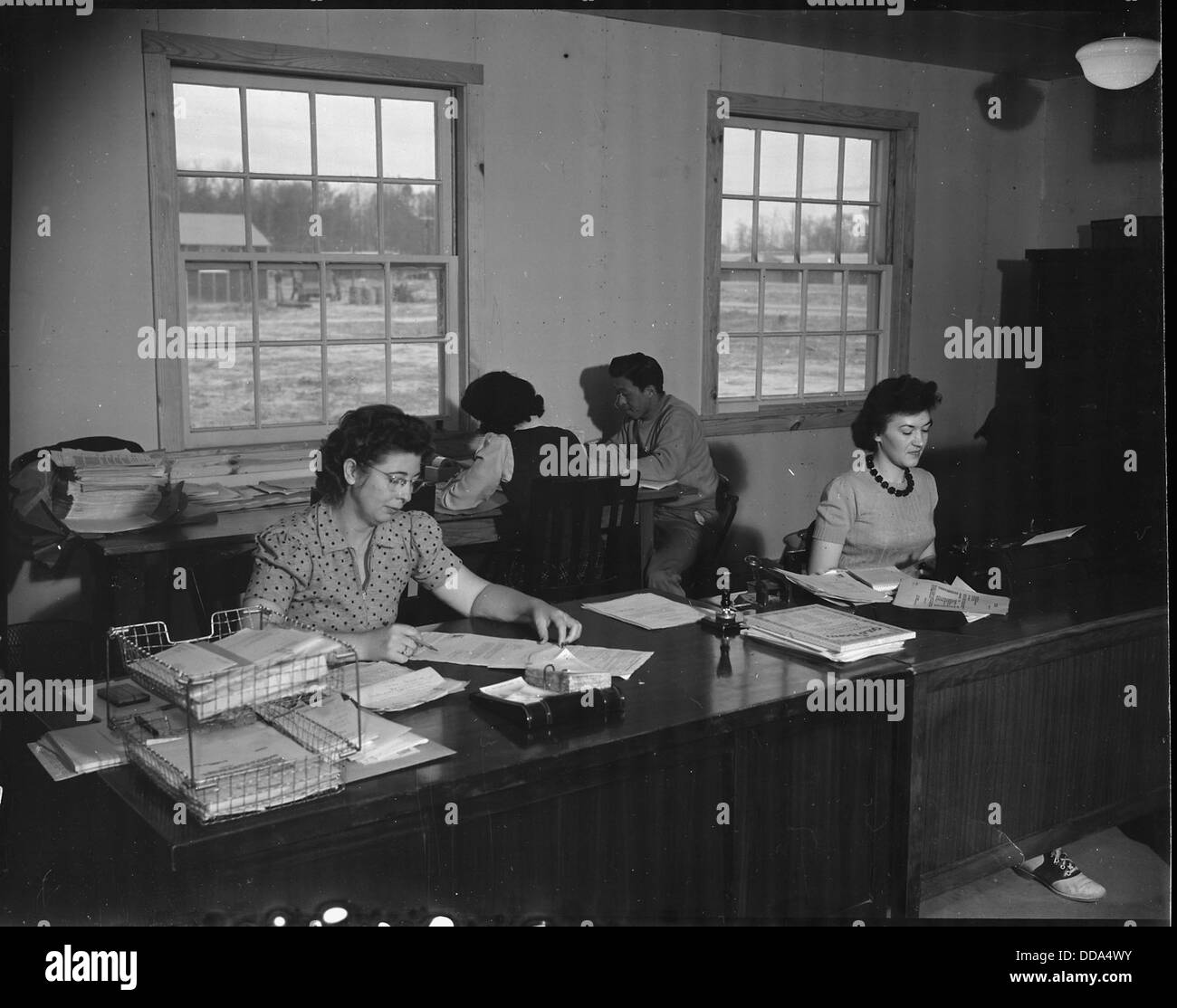 At the Rohwer Relocation Center in McGehee, Arkansas, the office staff ...
