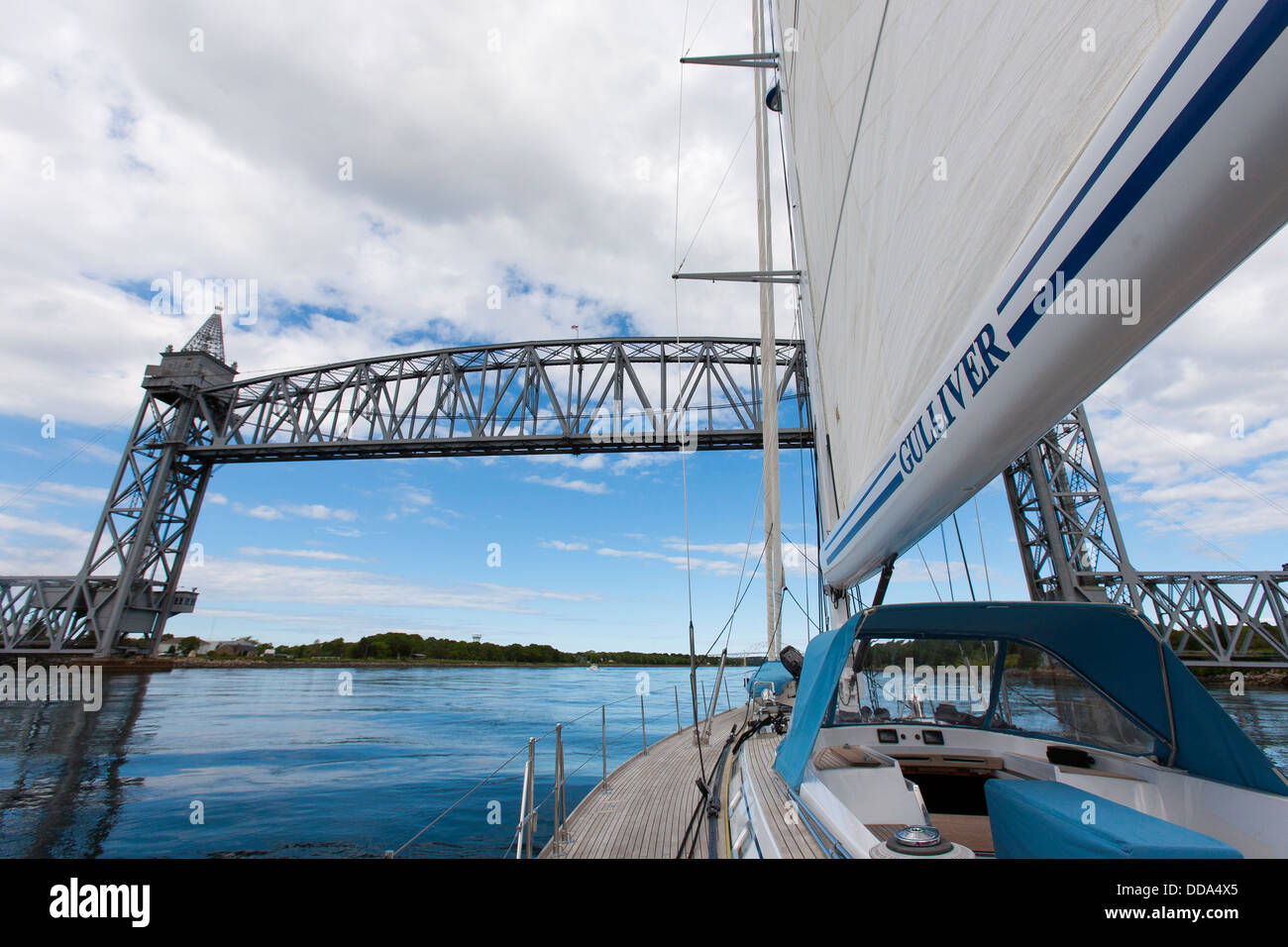 A sailing yacht with a British flag approaches the Cape Cod Canal ...