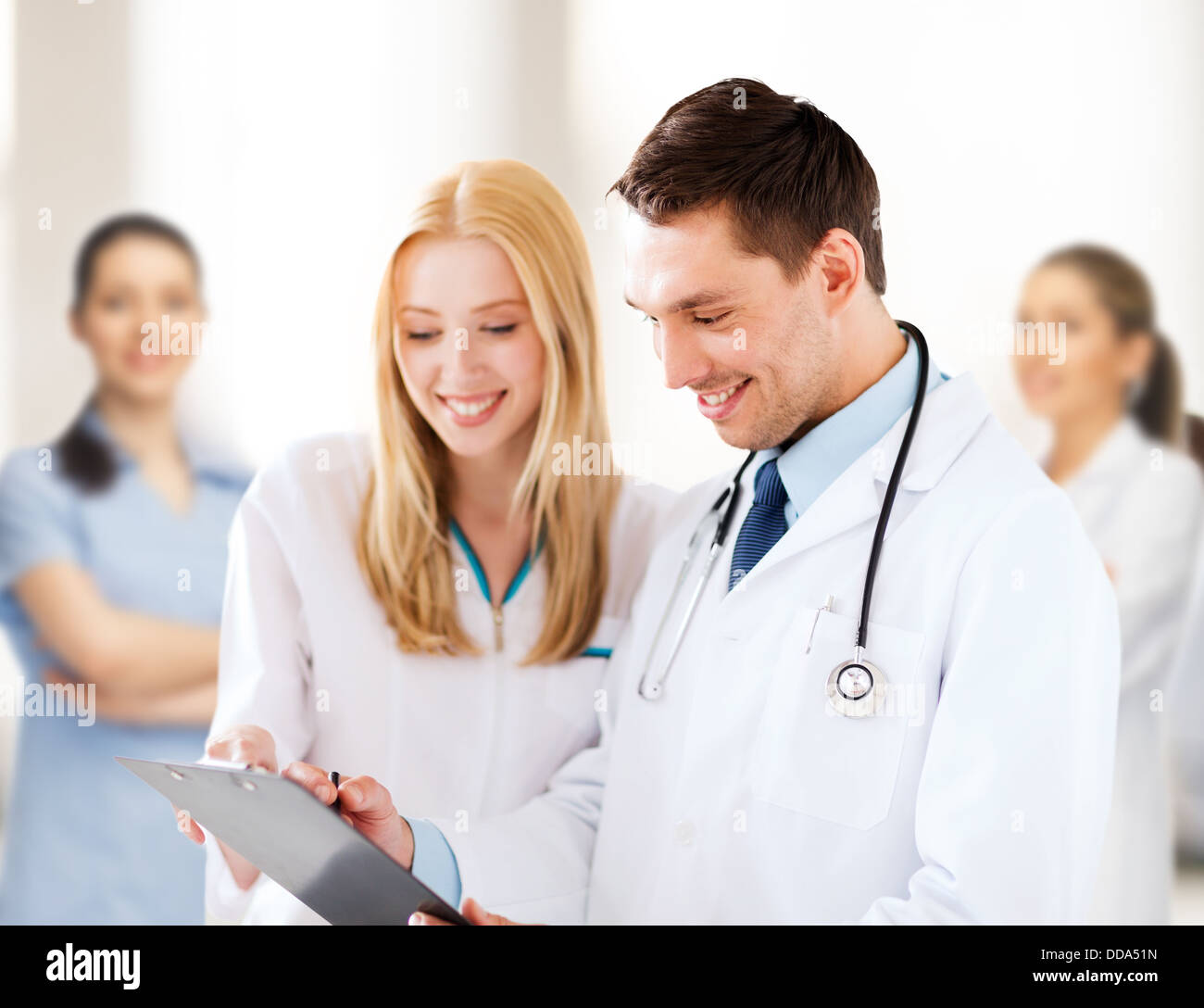 two doctors writing prescription Stock Photo - Alamy