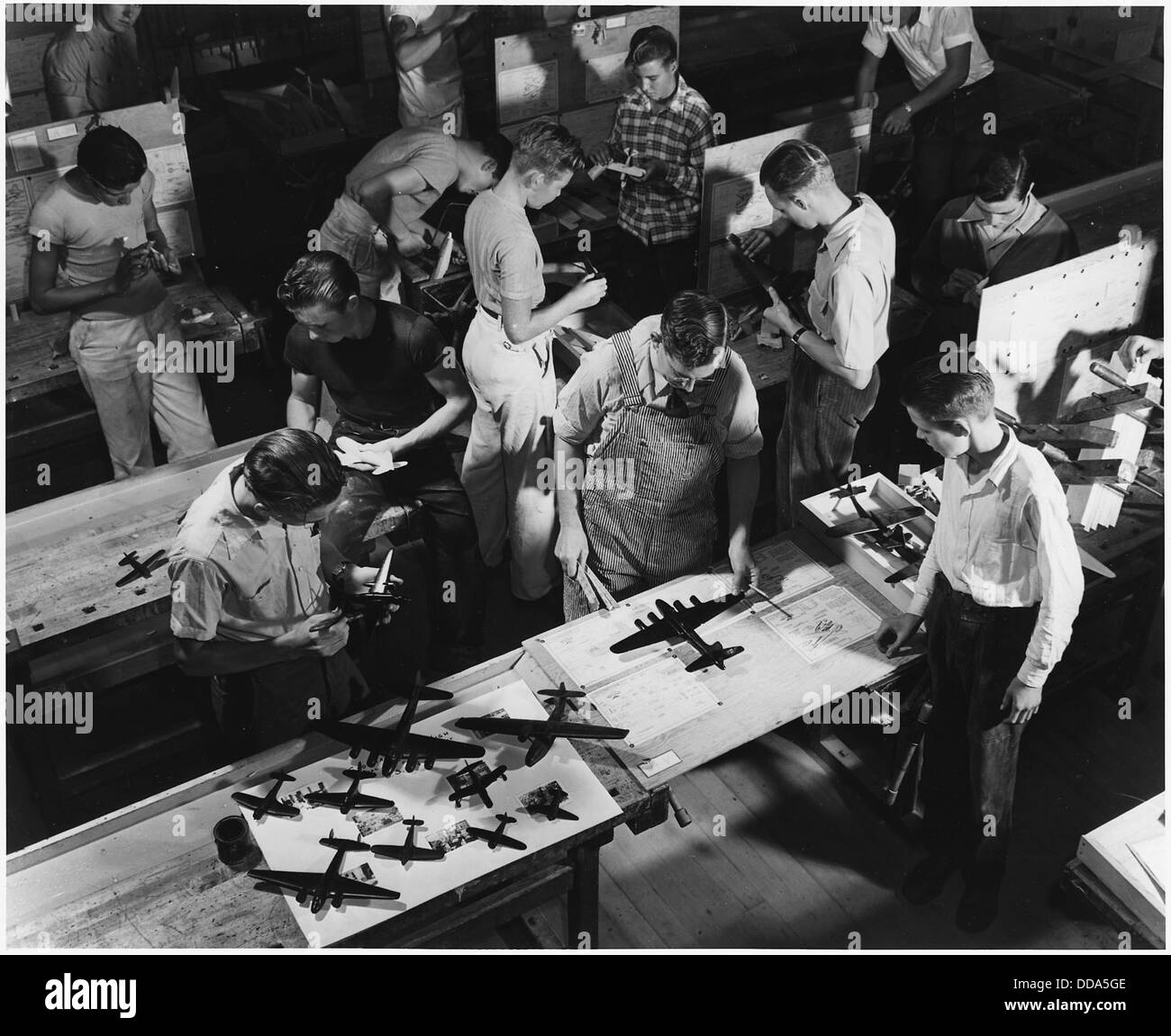 In the aftermath of the Pearl Harbor attack, students are seen building ...