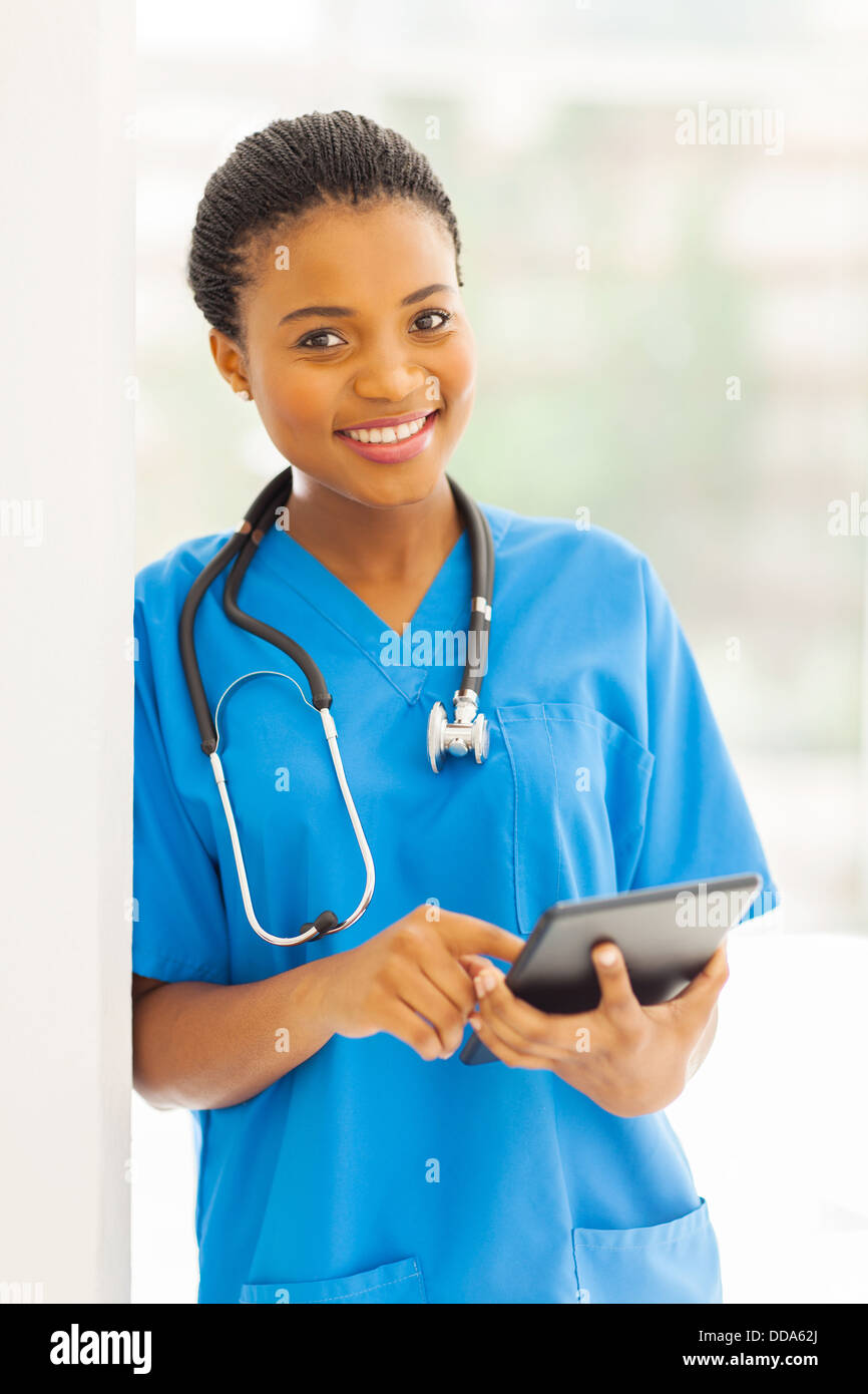 portrait of young African nurse using tablet pc Stock Photo - Alamy