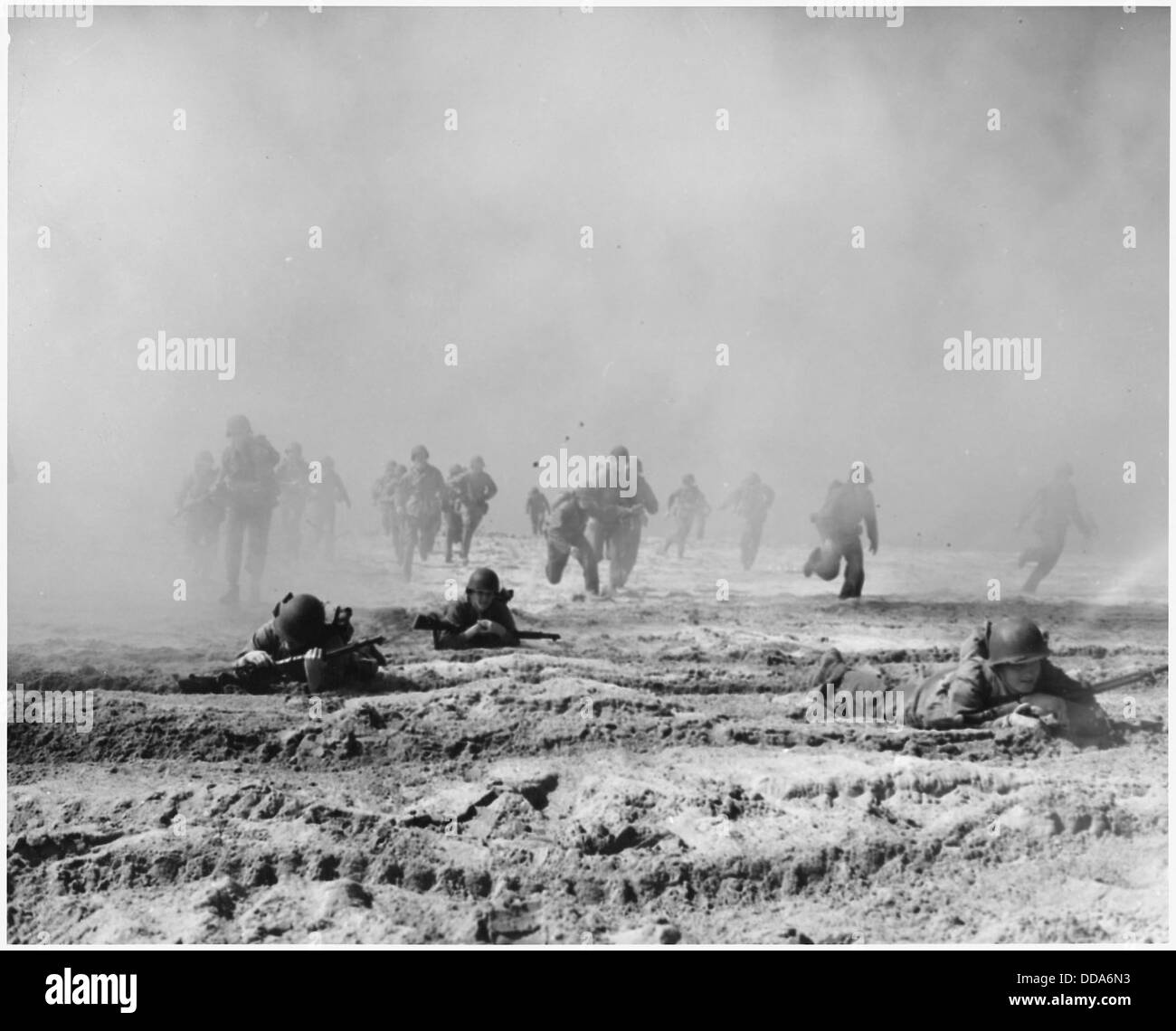 This image shows military personnel engaged in training camp maneuvers ...