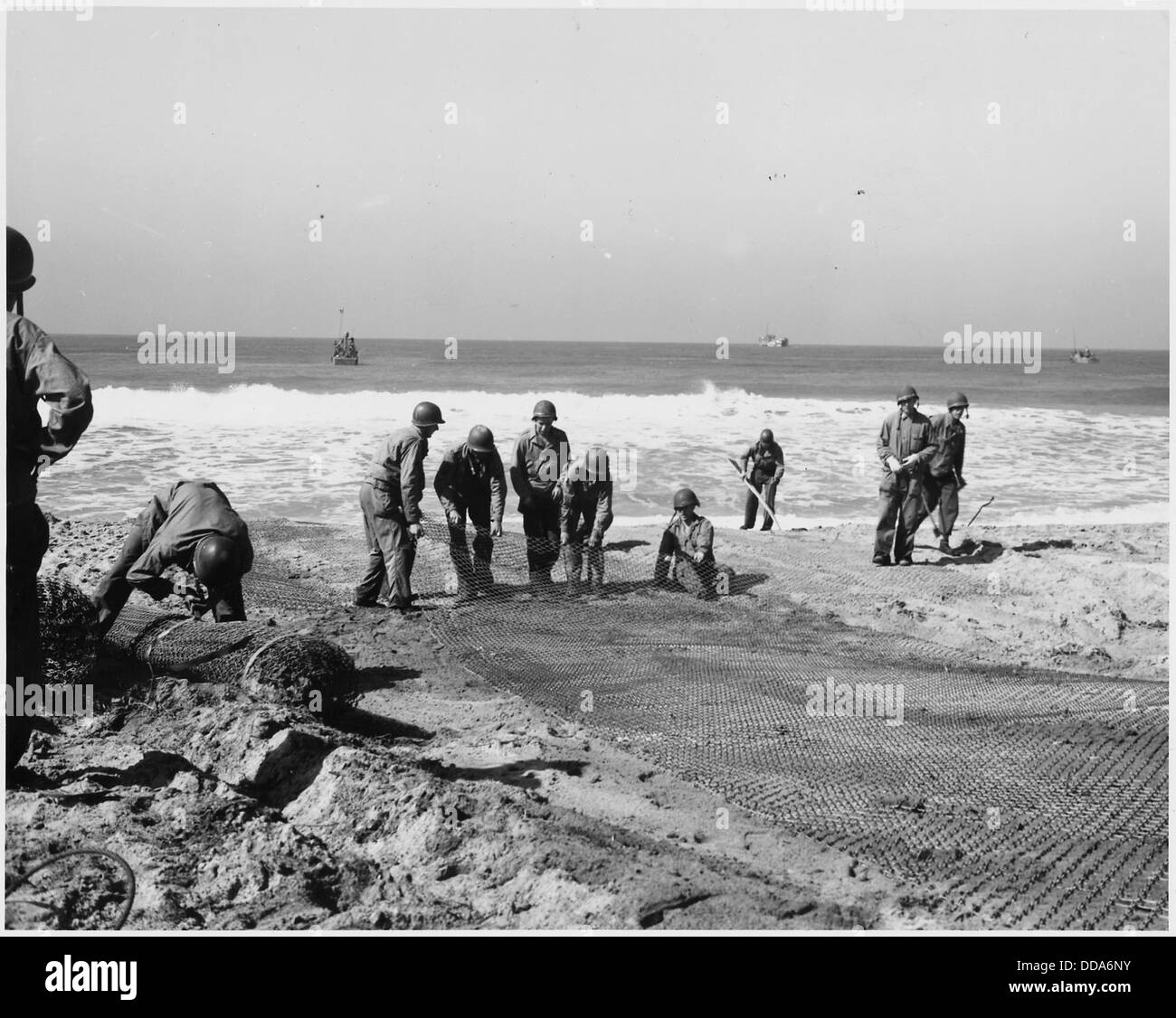Soldiers perform training maneuvers at a military camp, preparing for ...