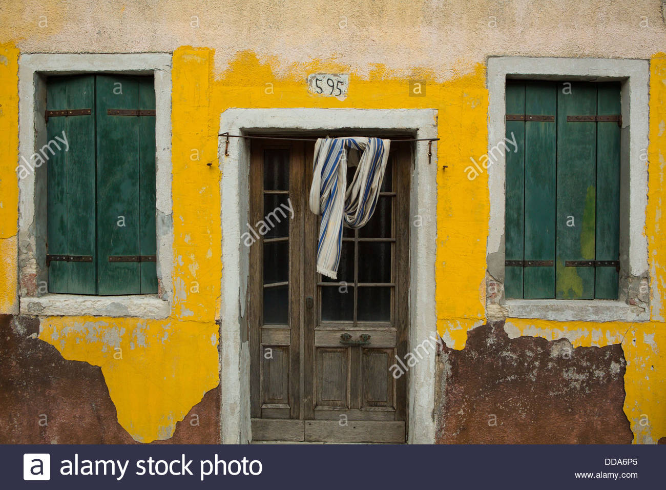 A weathered house front from the most colourful village in Italy Stock ...