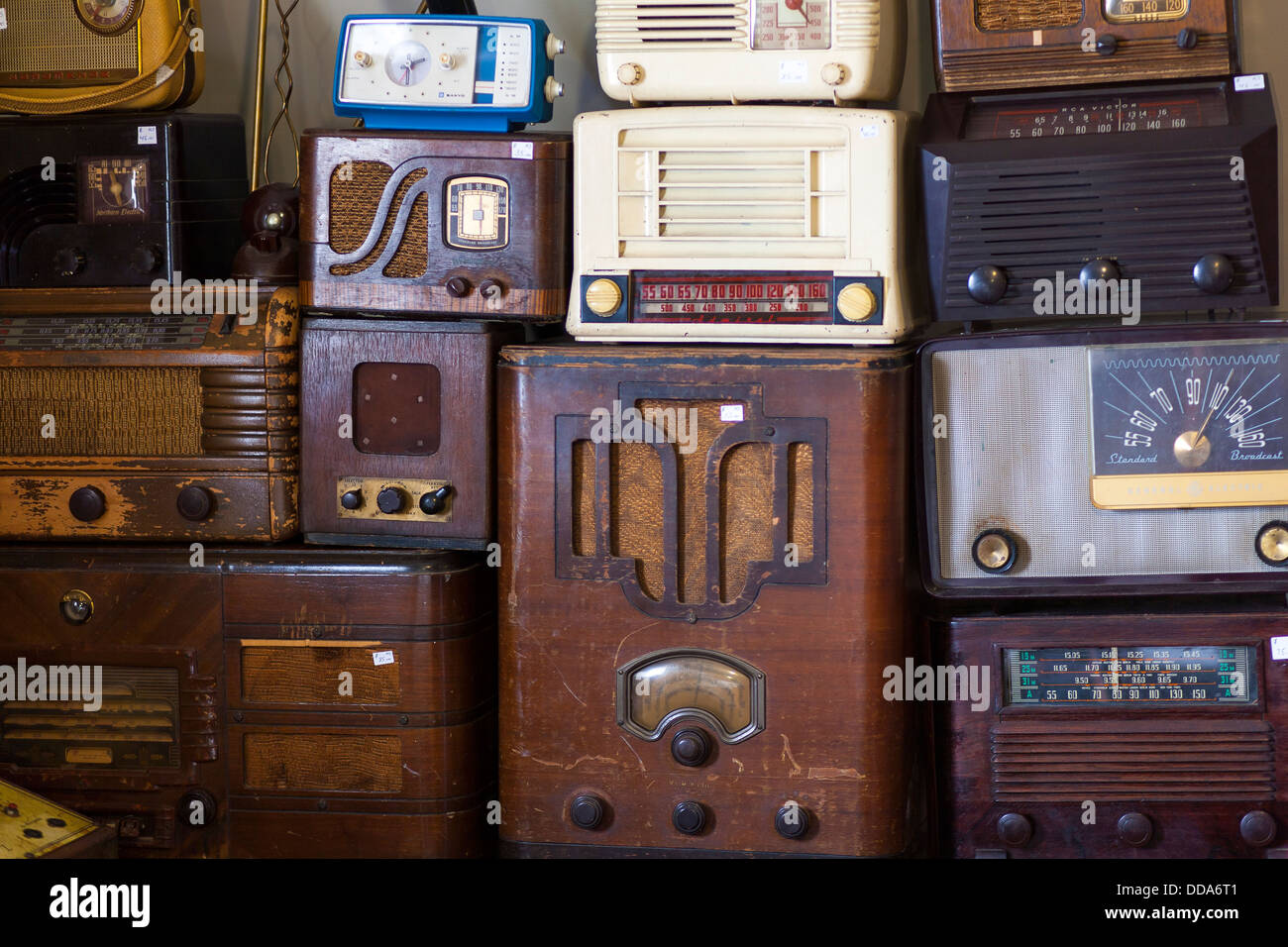 Discarded and old fashioned wireless radios in a second hand shop in ...