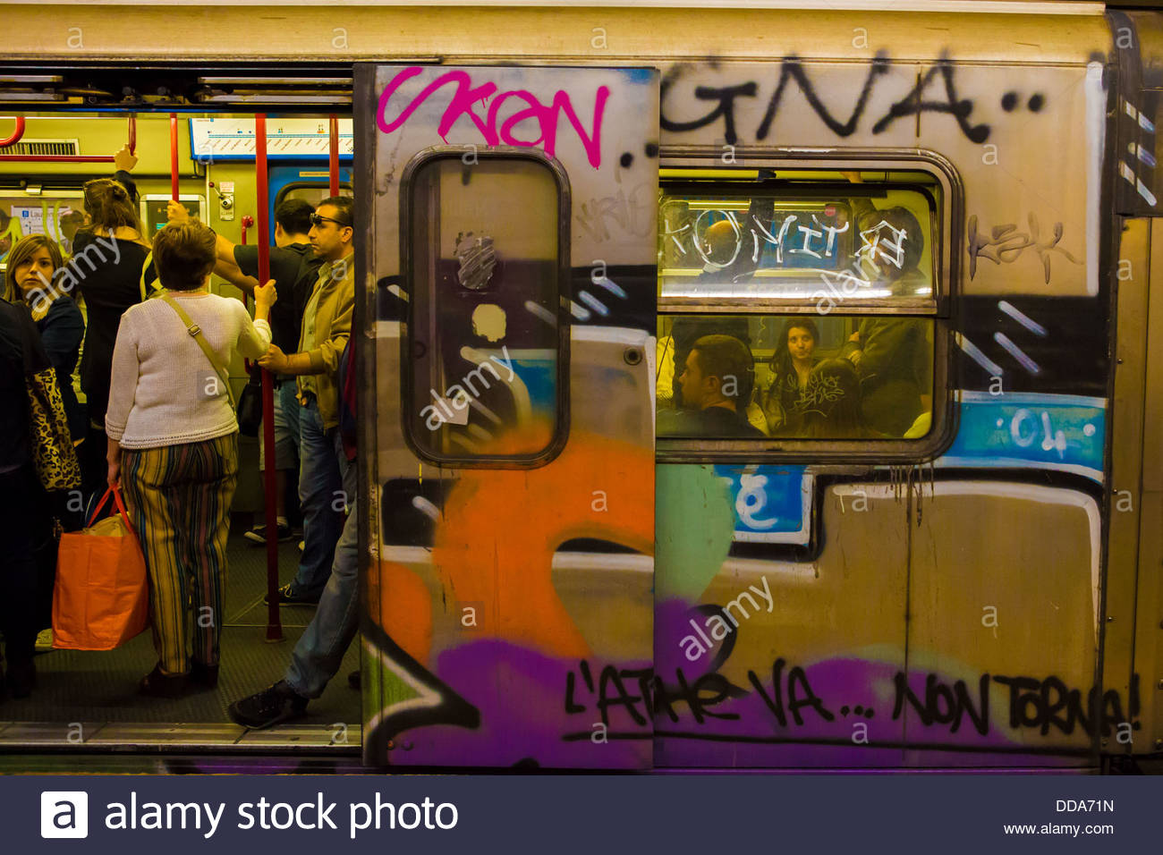 Commuters board the subway in Rome Stock Photo - Alamy