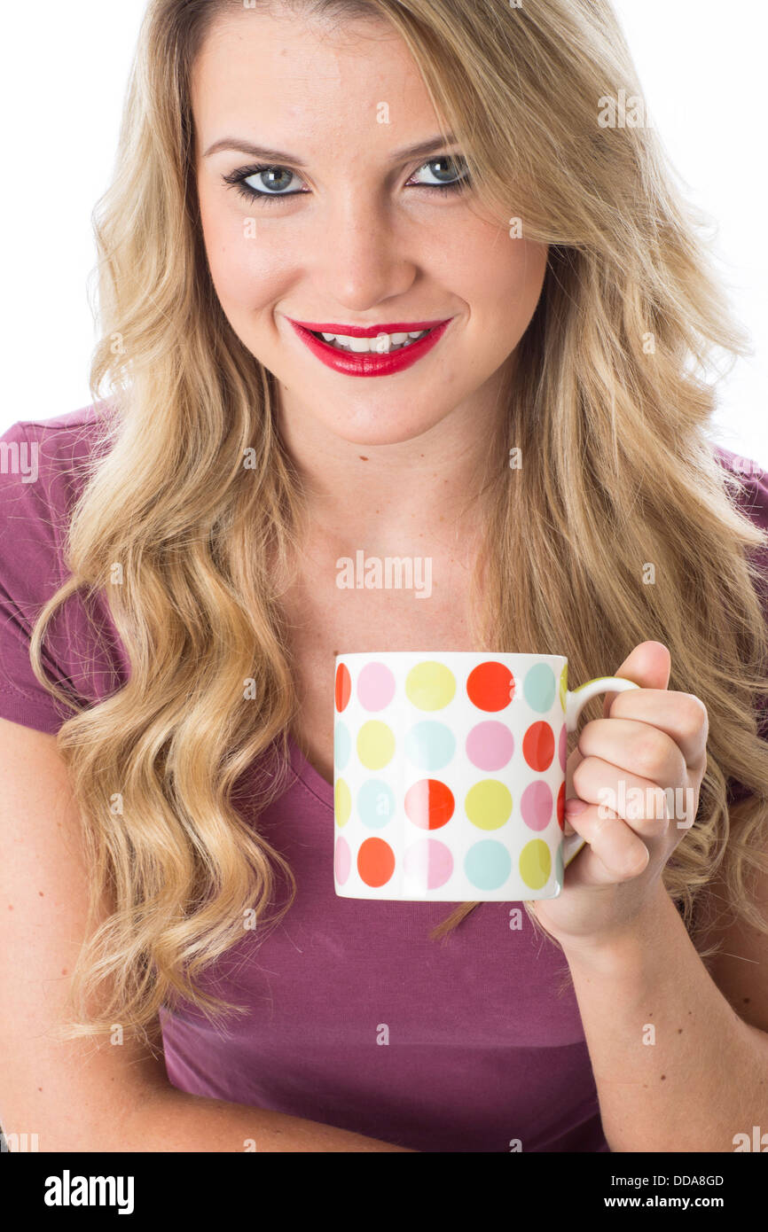 Model Released. Attractive Young Woman Drinking Tea Stock Photo - Alamy