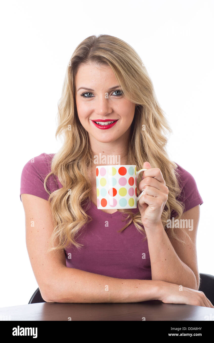 Model Released. Attractive Young Woman Drinking Tea Stock Photo - Alamy