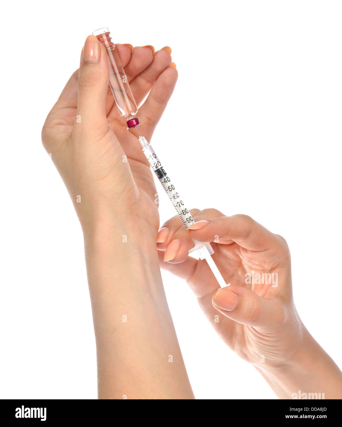 Doctor with medical syringe with needle in ampule getting ready for ...