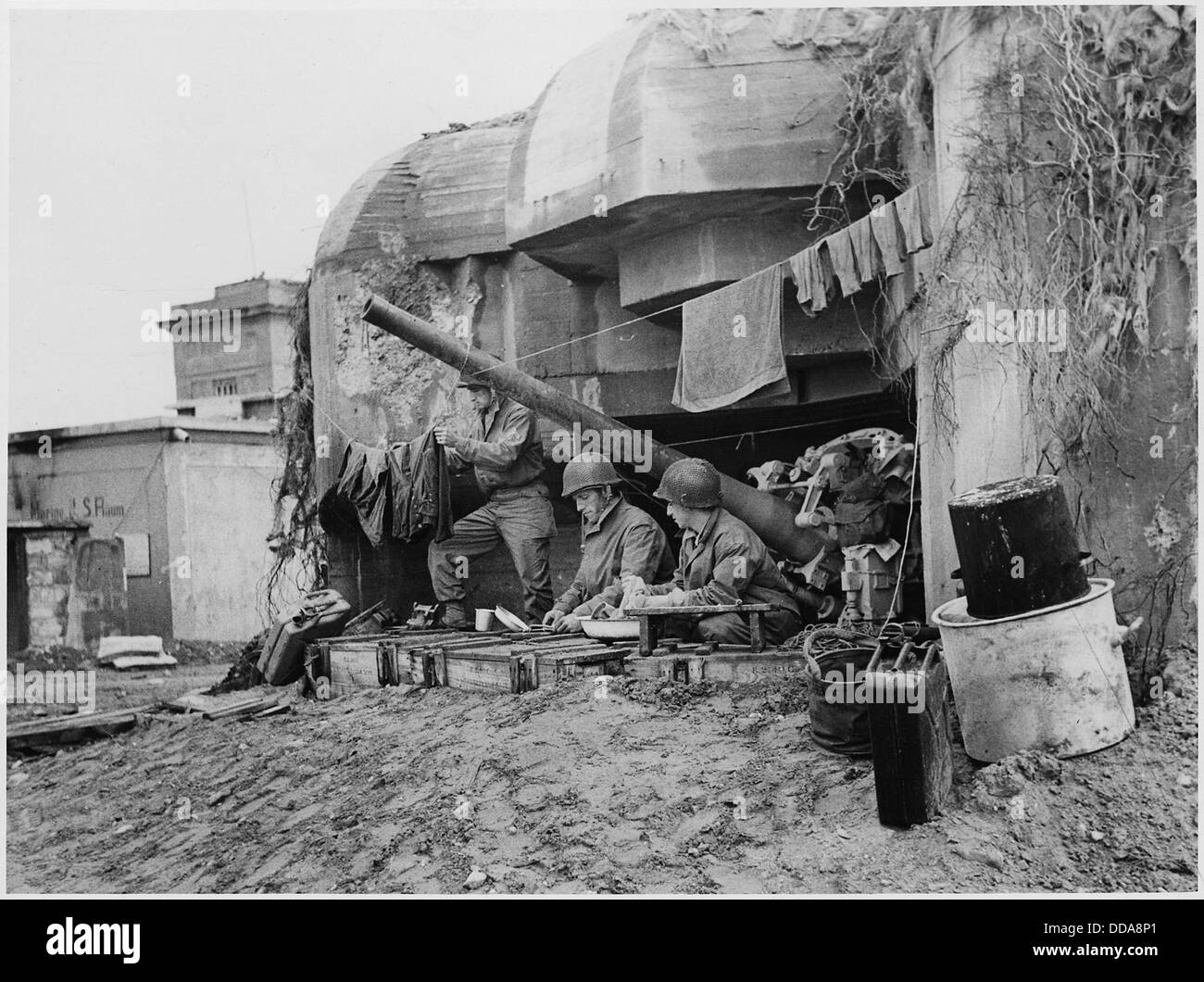Allied soldiers are shown doing laundry in a captured German pillbox in ...