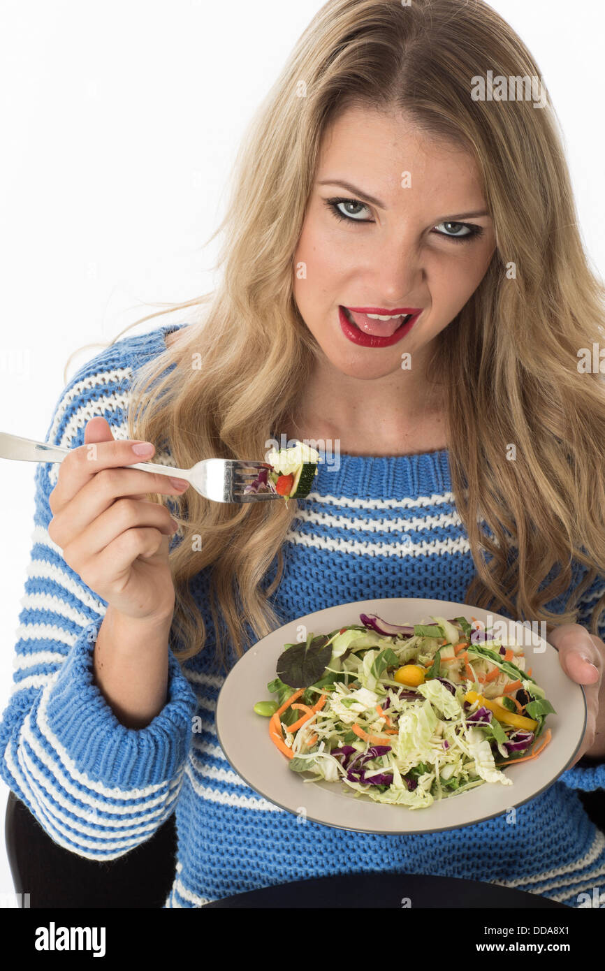Model Released. Attractive Young Woman Eating Mixed Vegetables Stock ...