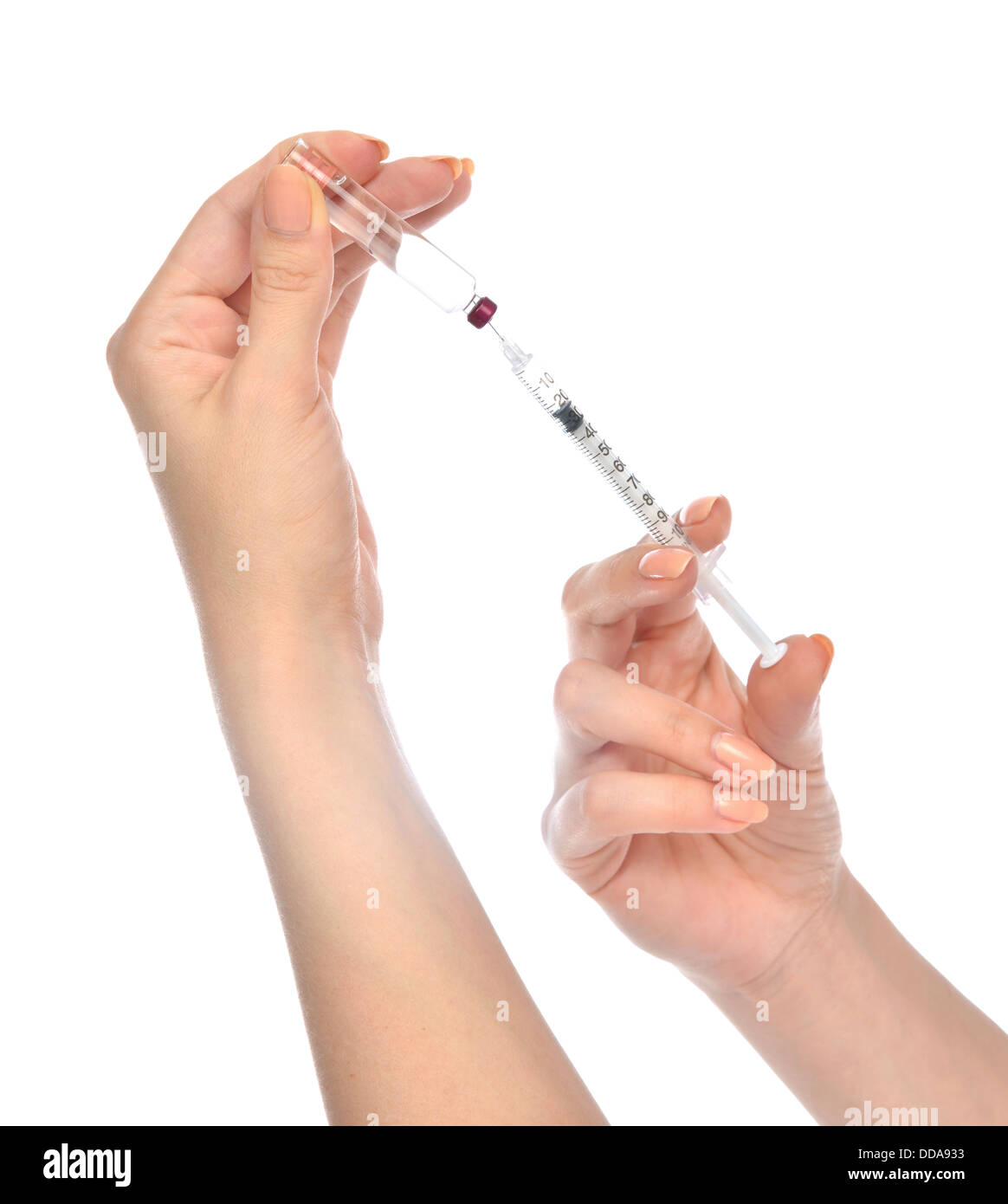 Doctor hands with medical syringe with needle in ampule getting ready ...