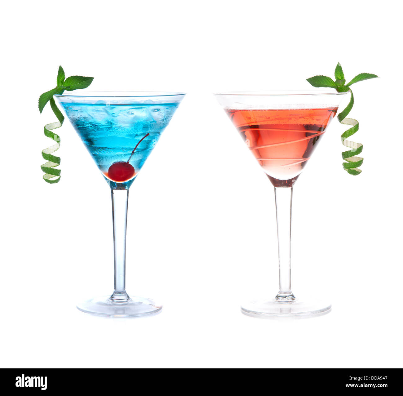 Red and blue alcohol cosmopolitan cocktails drinks with mint in martini ...