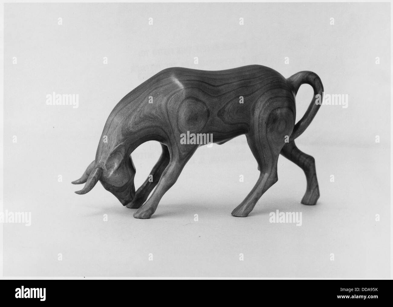 Wood carving of a bull by carl mccoy hi-res stock photography and ...