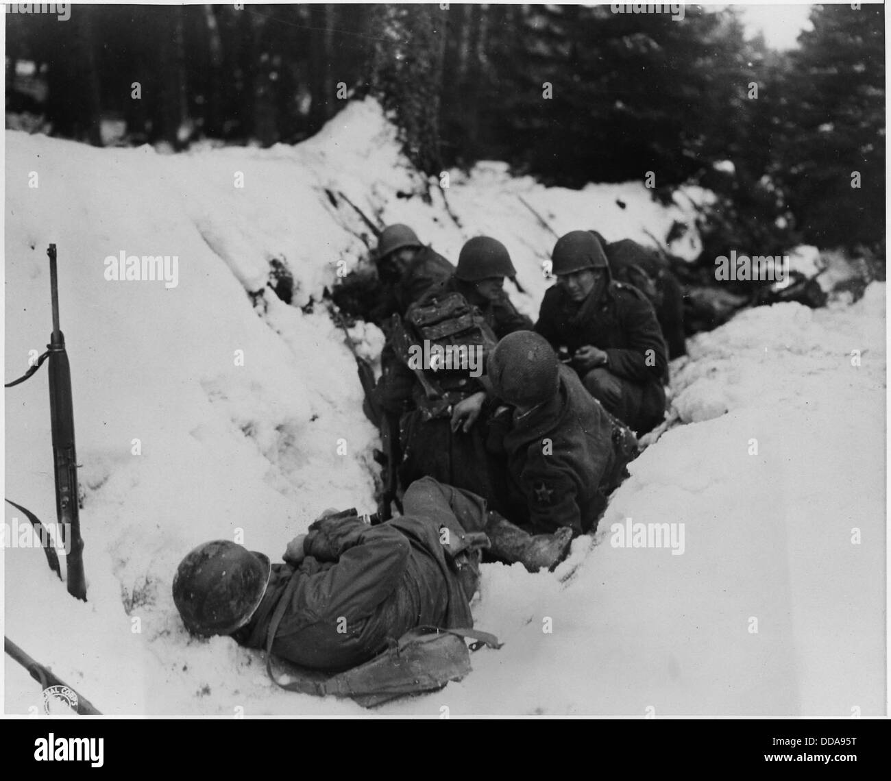This photograph shows U.S. soldiers taking cover under fire during ...