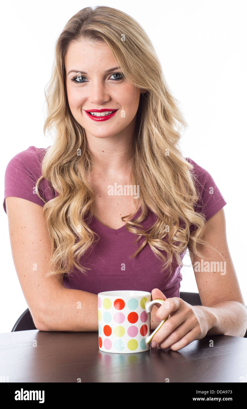 Model Released. Attractive Young Woman Drinking Tea Stock Photo - Alamy