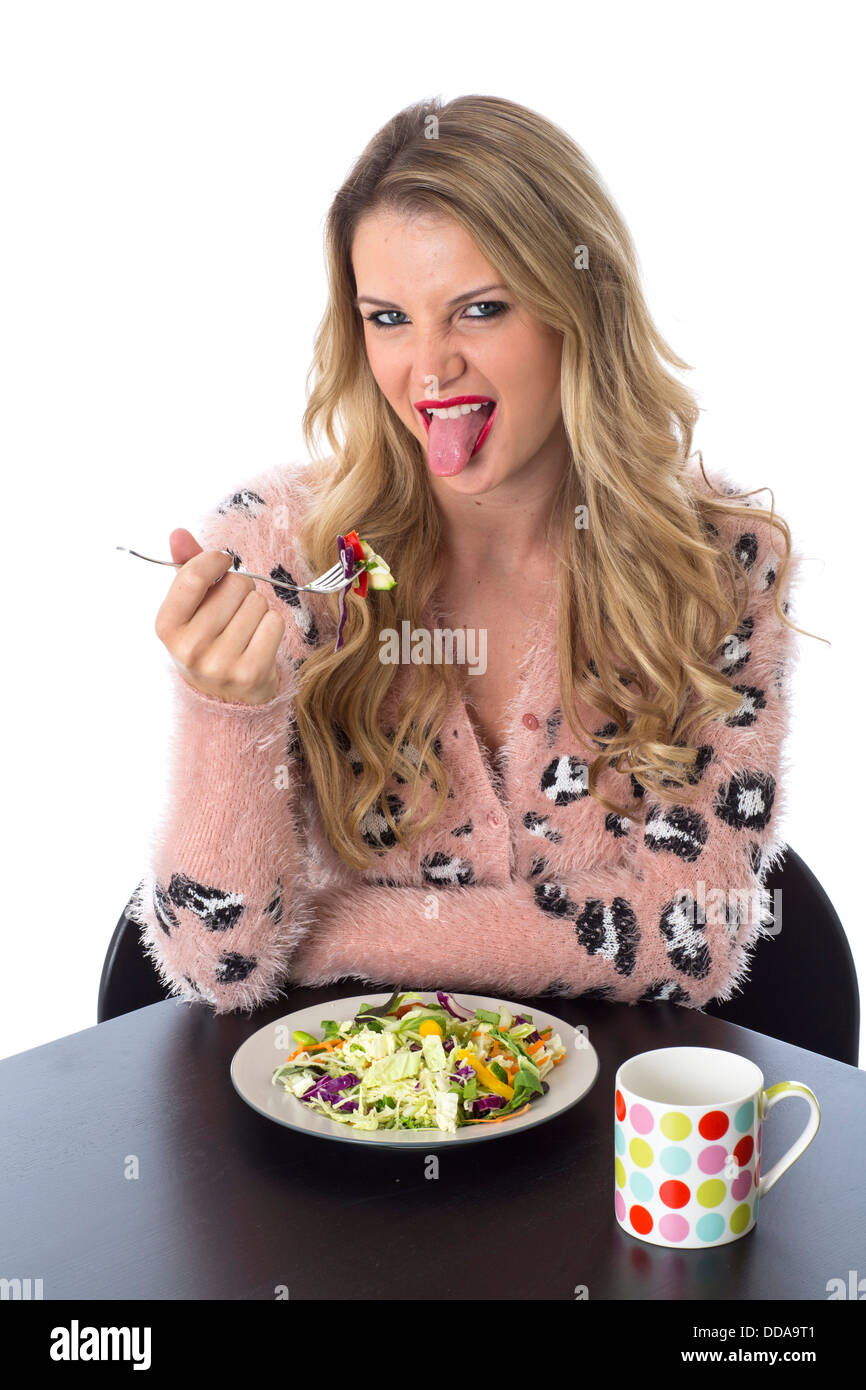 Model Released. Attractive Young Woman Eating Mixed Vegetables Stock ...
