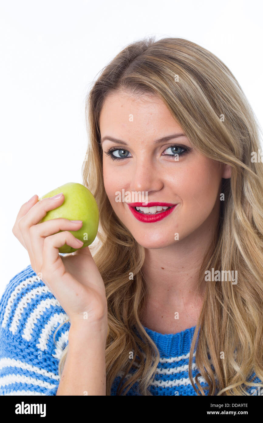 Model Released. Attractive Young Woman Holding an Apple Stock Photo - Alamy