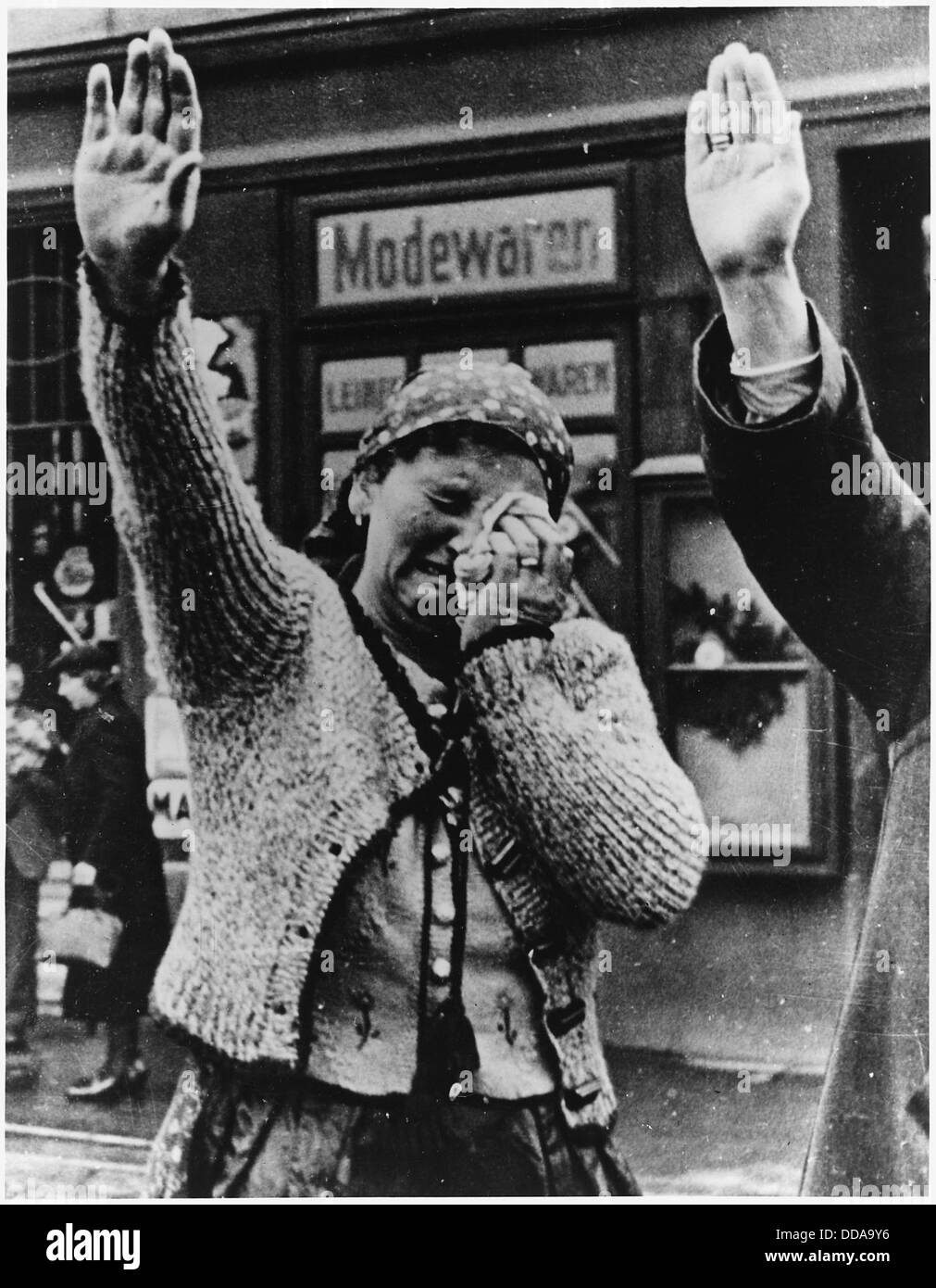 A woman is seen crying as she hails Hitler during WWII in Germany ...