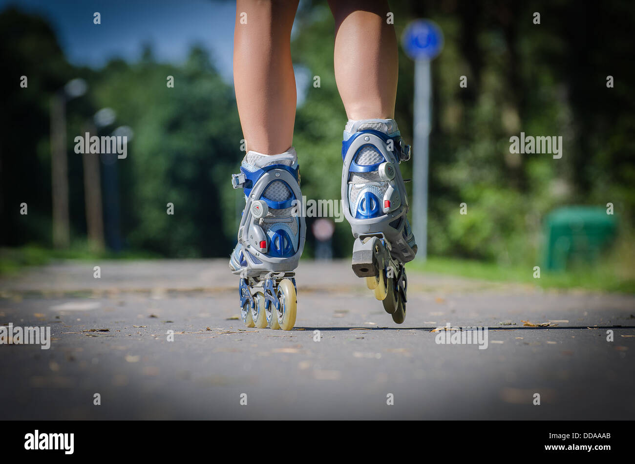 Close-up view of female legs in roller blades Stock Photo - Alamy