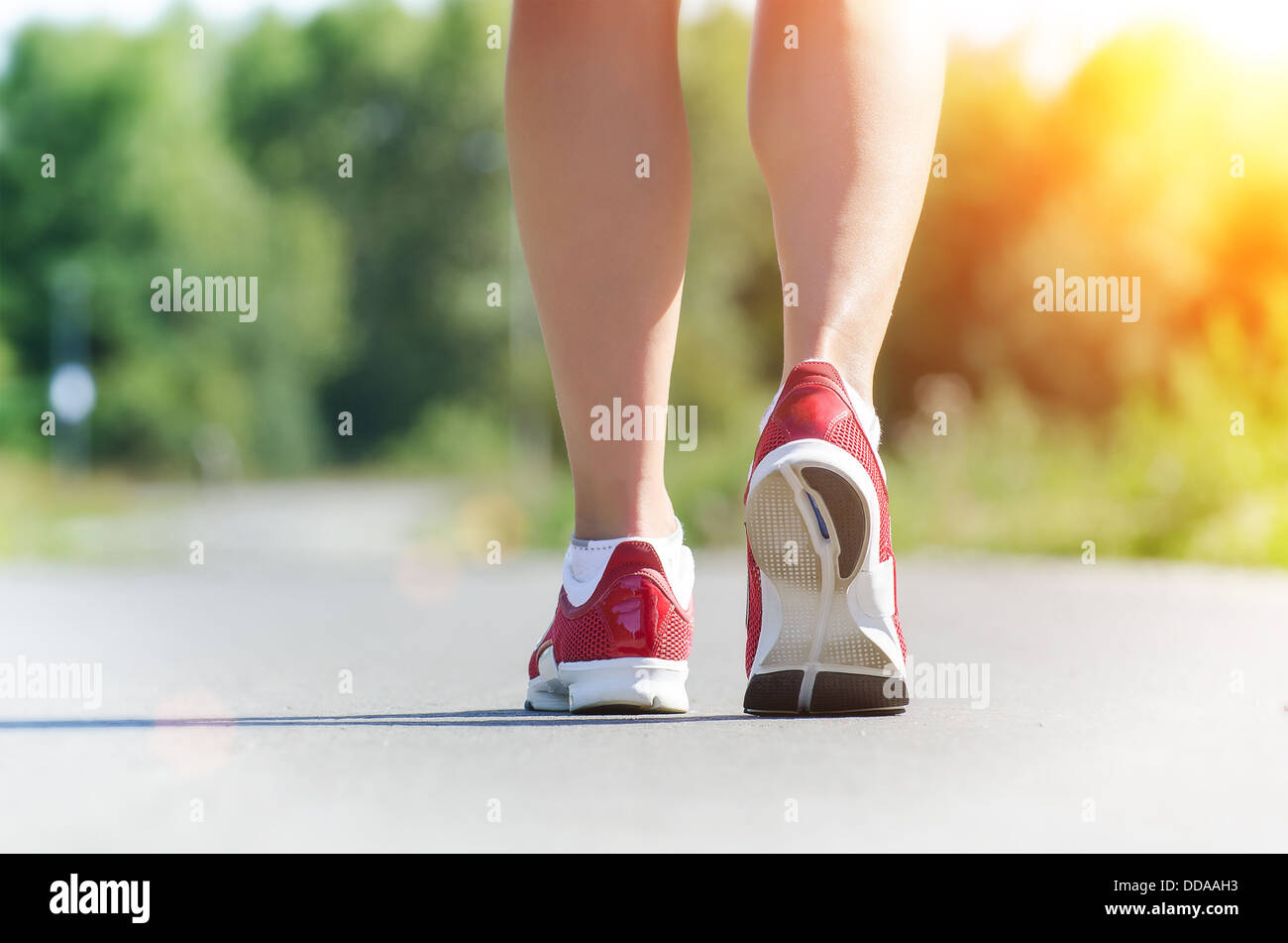 Female legs during outdoor workout at sunrise. Concept Stock Photo - Alamy