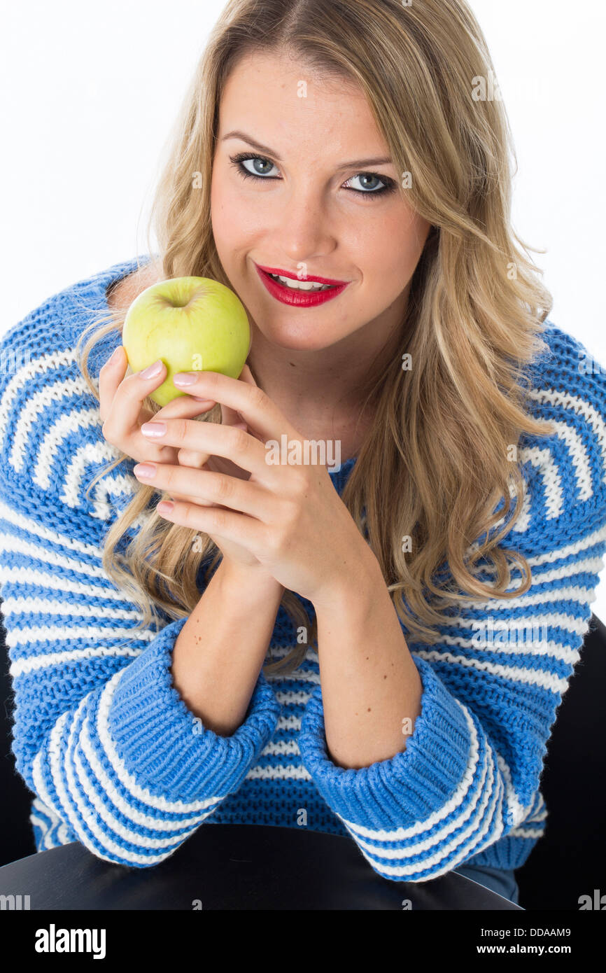 Model Released. Attractive Young Woman Holding an Apple Stock Photo - Alamy