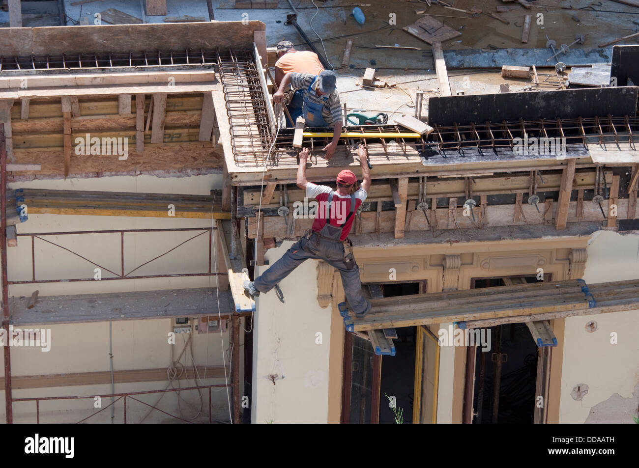 Builders working on house Stock Photo - Alamy