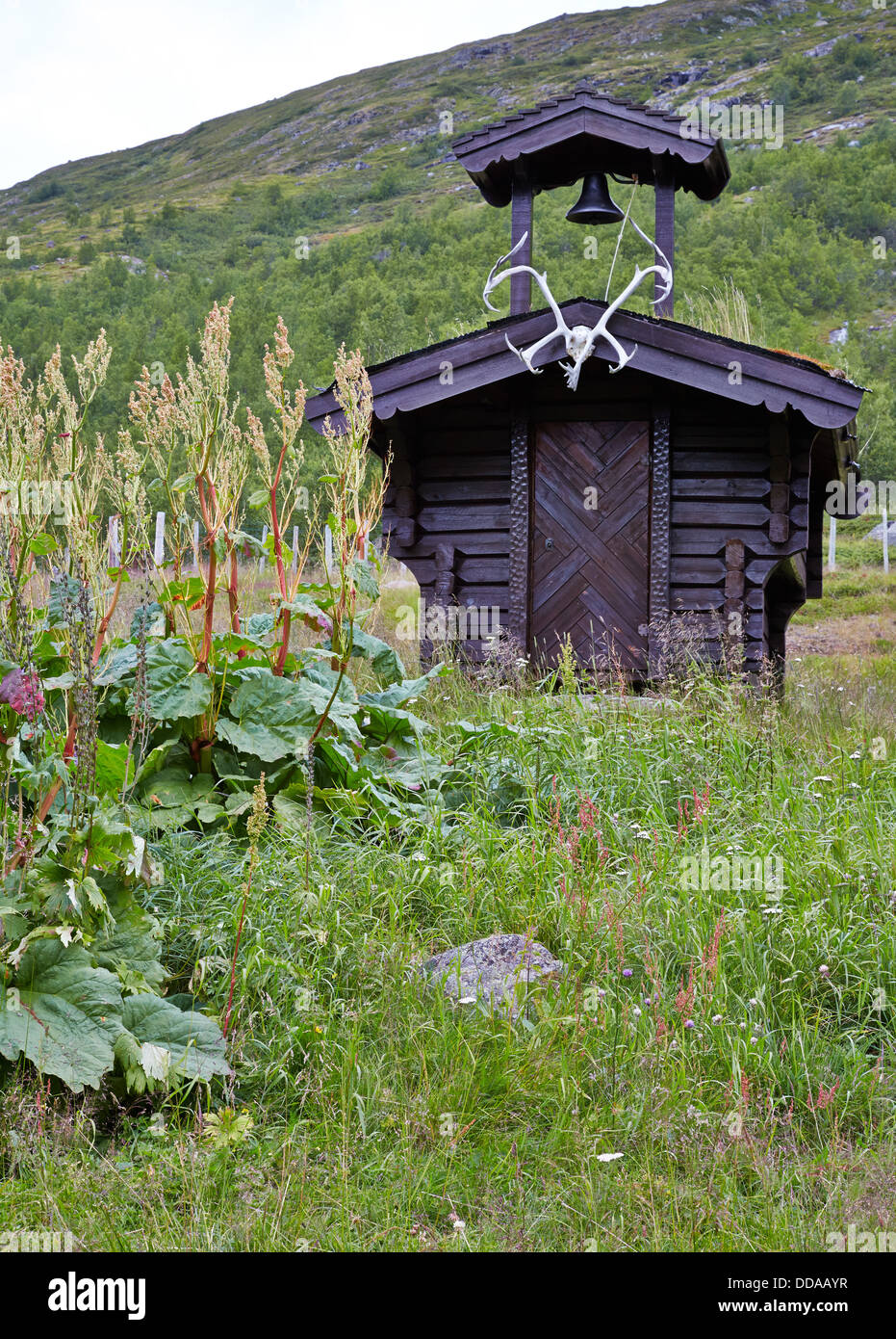 Wooden chapel with bell tower and reindeer antlers at Memurubu by Lake ...