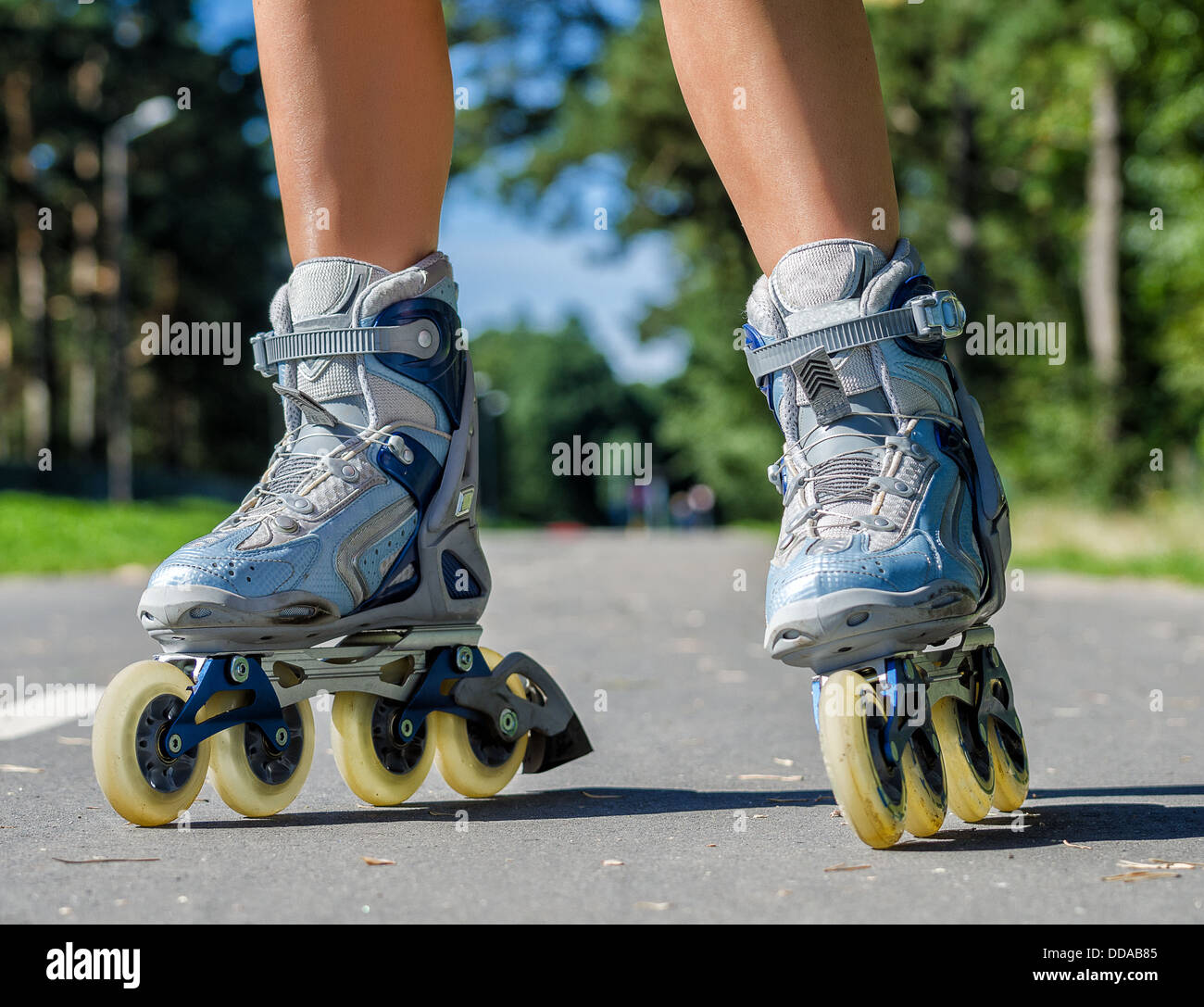 Close-up view of female legs in roller blades Stock Photo - Alamy