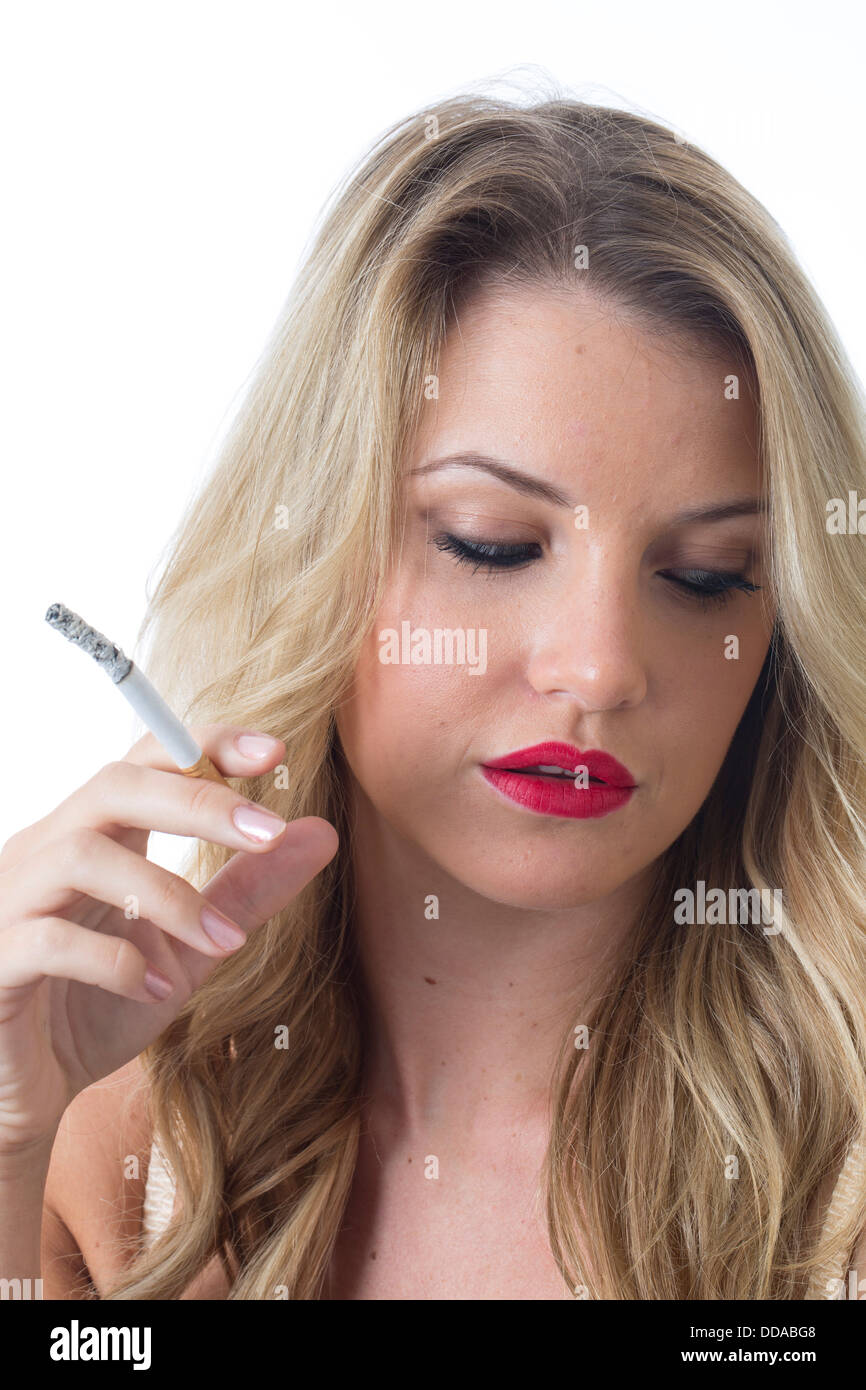 Confident Positive Young Woman Holding And Smoking A Cigarette Ignoring ...