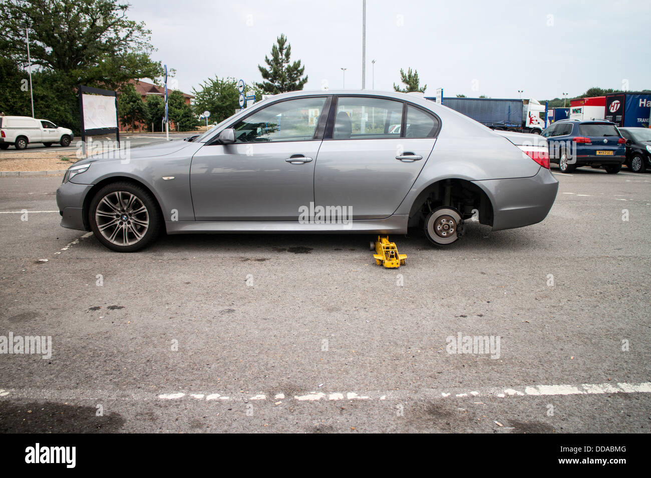 BMW missing it's rear wheel Stock Photo - Alamy