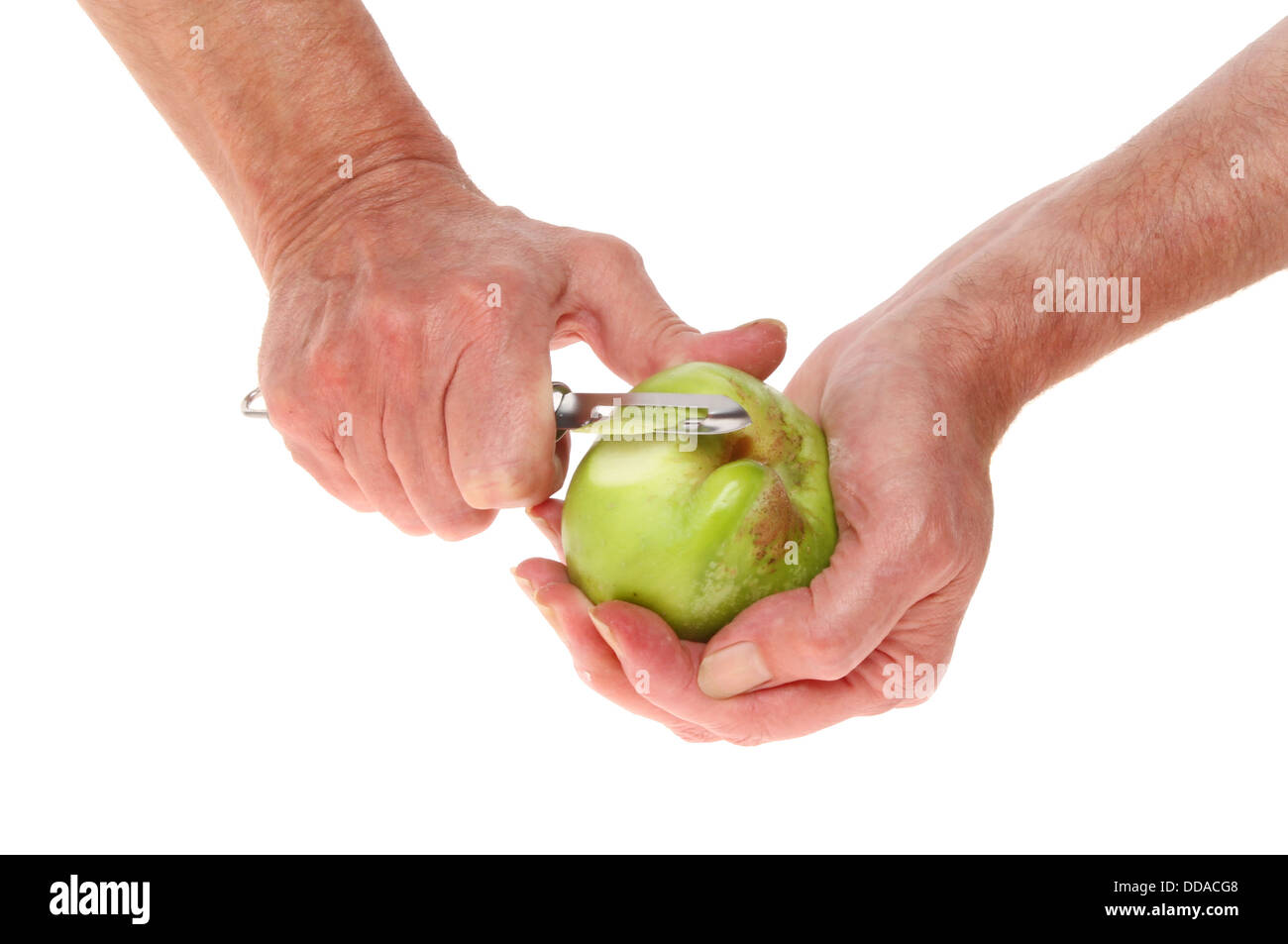 Hands peeling a cooking apple isolated against white Stock Photo - Alamy