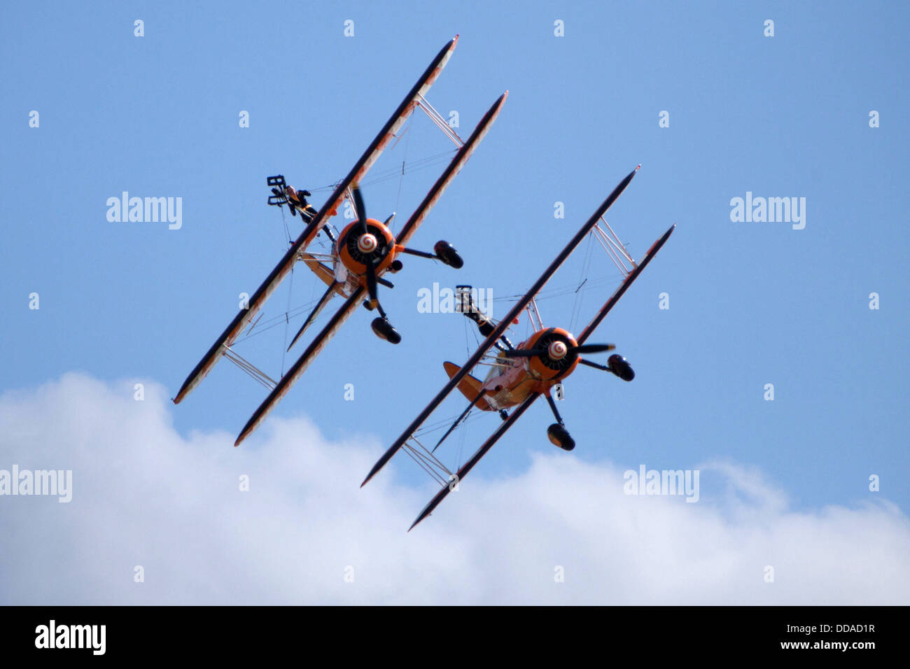biplane wing walking danger entertainment plane duxford Stock Photo - Alamy