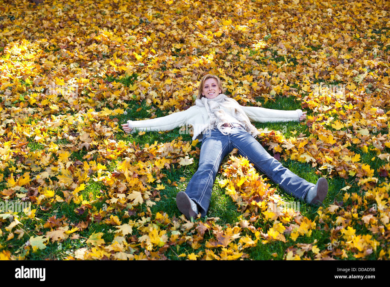 Beautiful woman making angels in hi-res stock photography and images ...