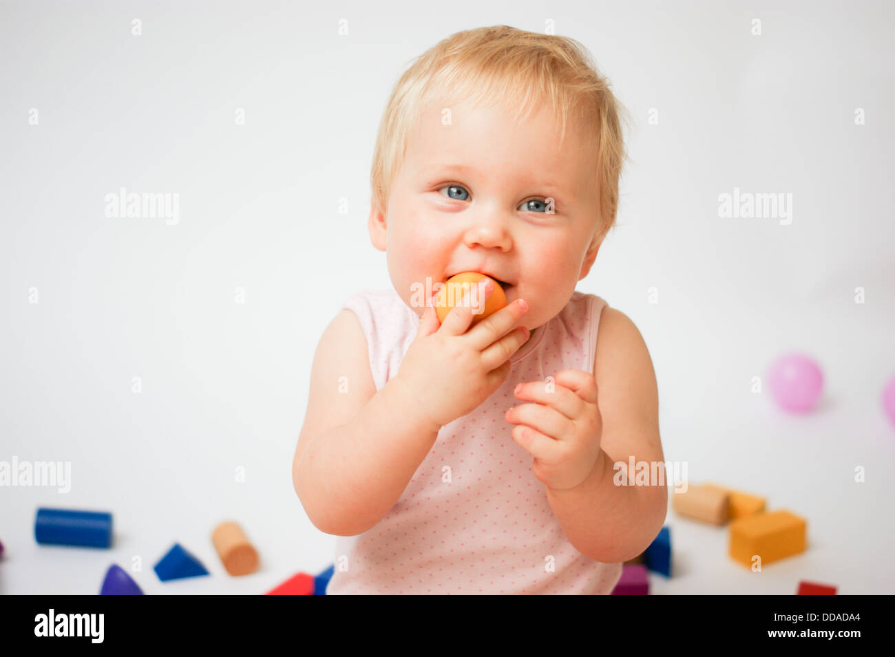 Smiling baby with toys Stock Photo - Alamy Smiling baby with toys Stock Photo - Alamy