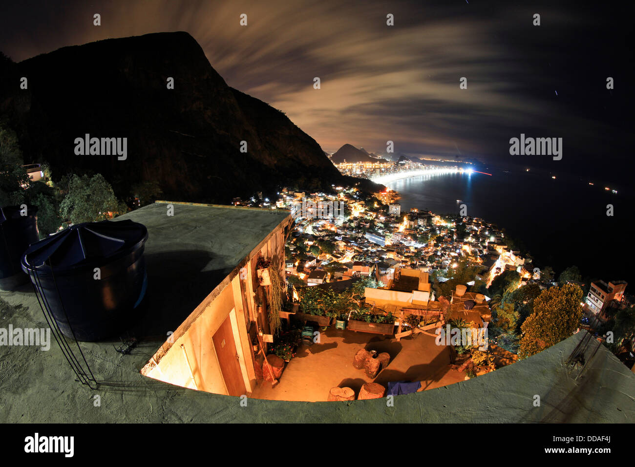 Night view from top of Favela do Vidigal. Leblon and Ipanema beaches in ...