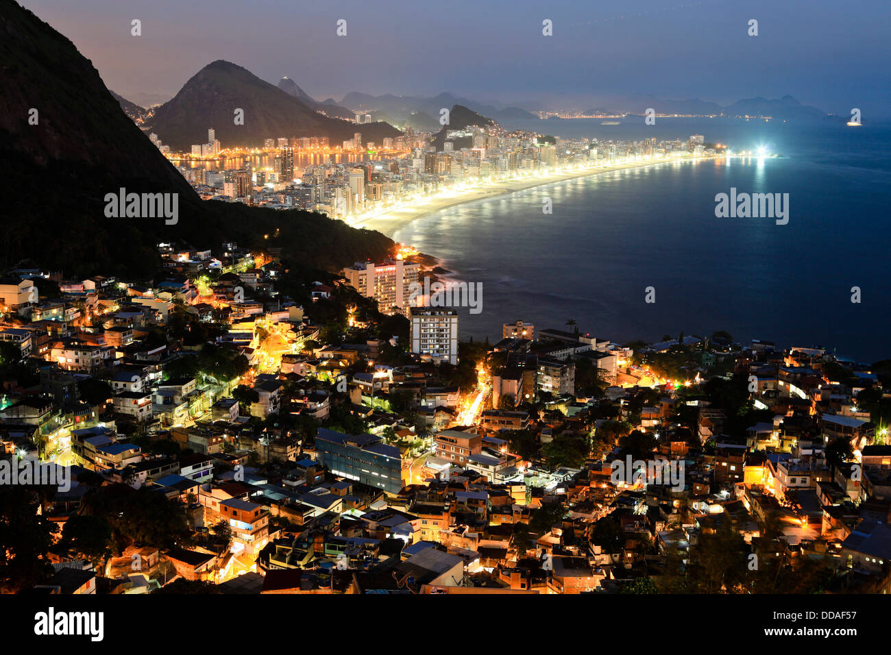 Night view from top of Favela do Vidigal. Leblon and Ipanema beaches in ...