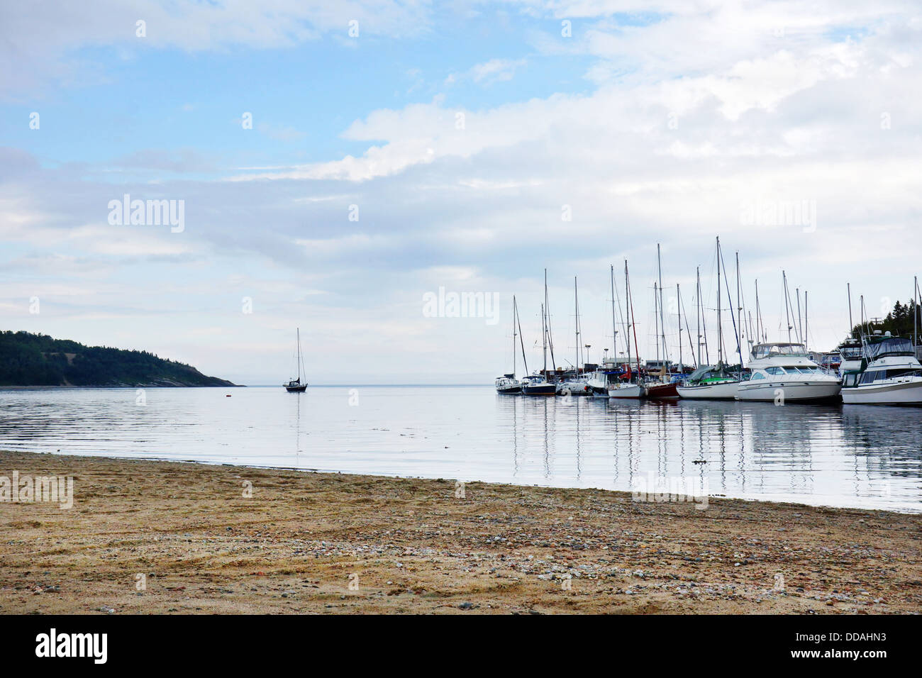 Sailboats in the harbor and beautiful beach Stock Photo - Alamy