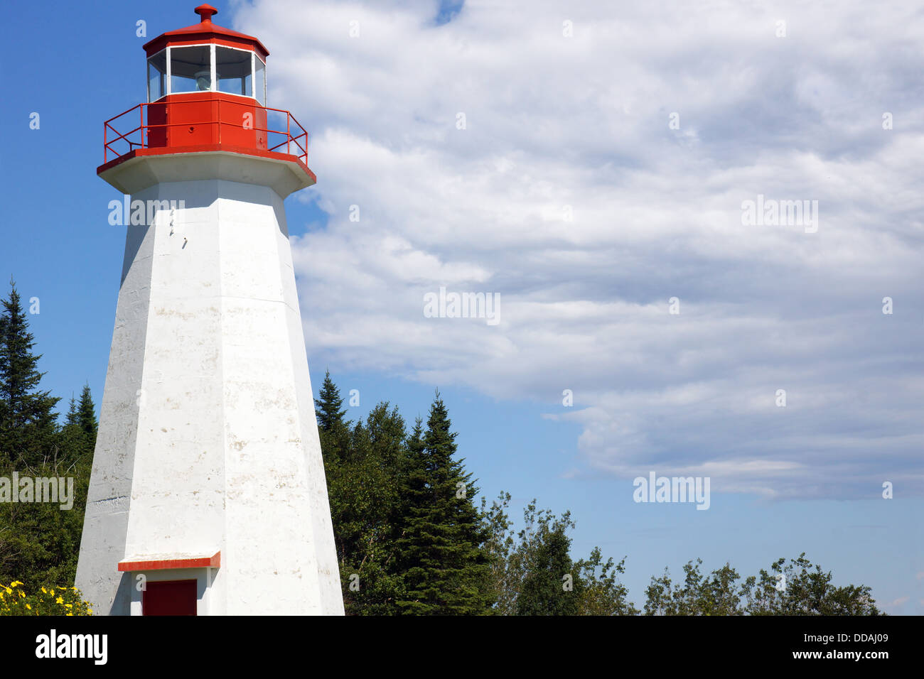 Lighthouse and bright blue sky Stock Photo - Alamy