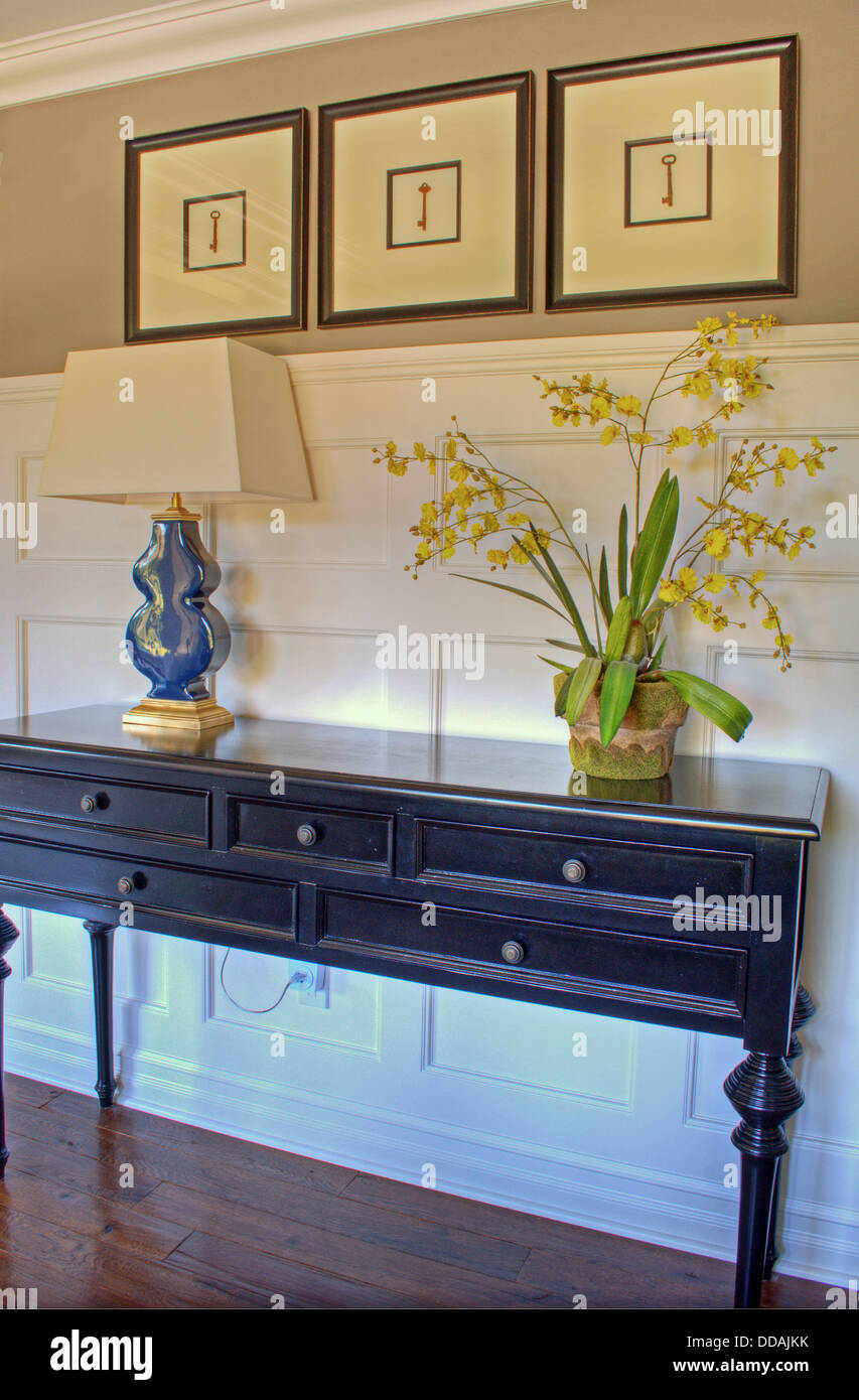 This is the entry way decor area of a beautiful home. It's got a long ...