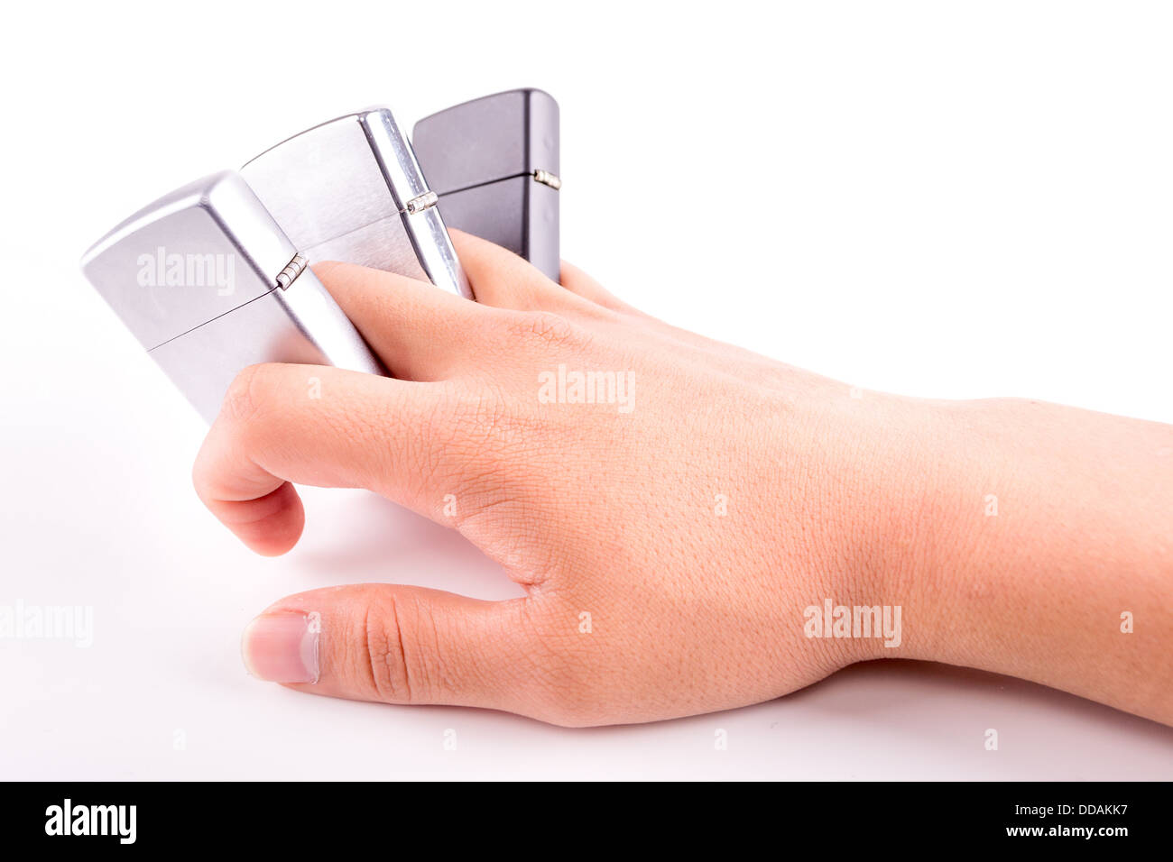 hand holding metal lighters isolated on white background Stock Photo ...
