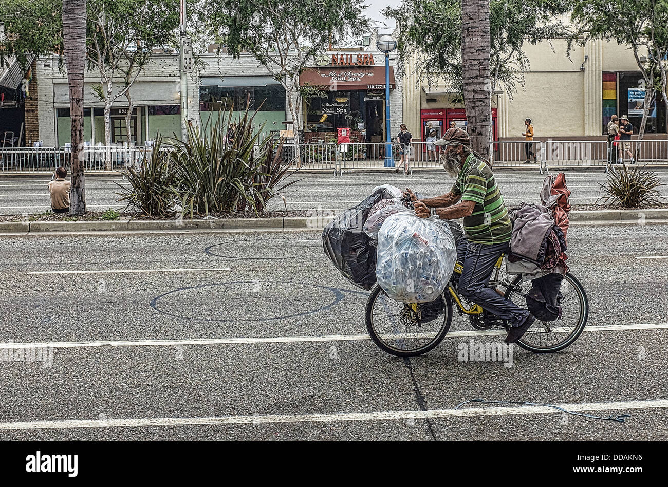 Homeless man doing scavenger garbage recycling Stock Photo - Alamy