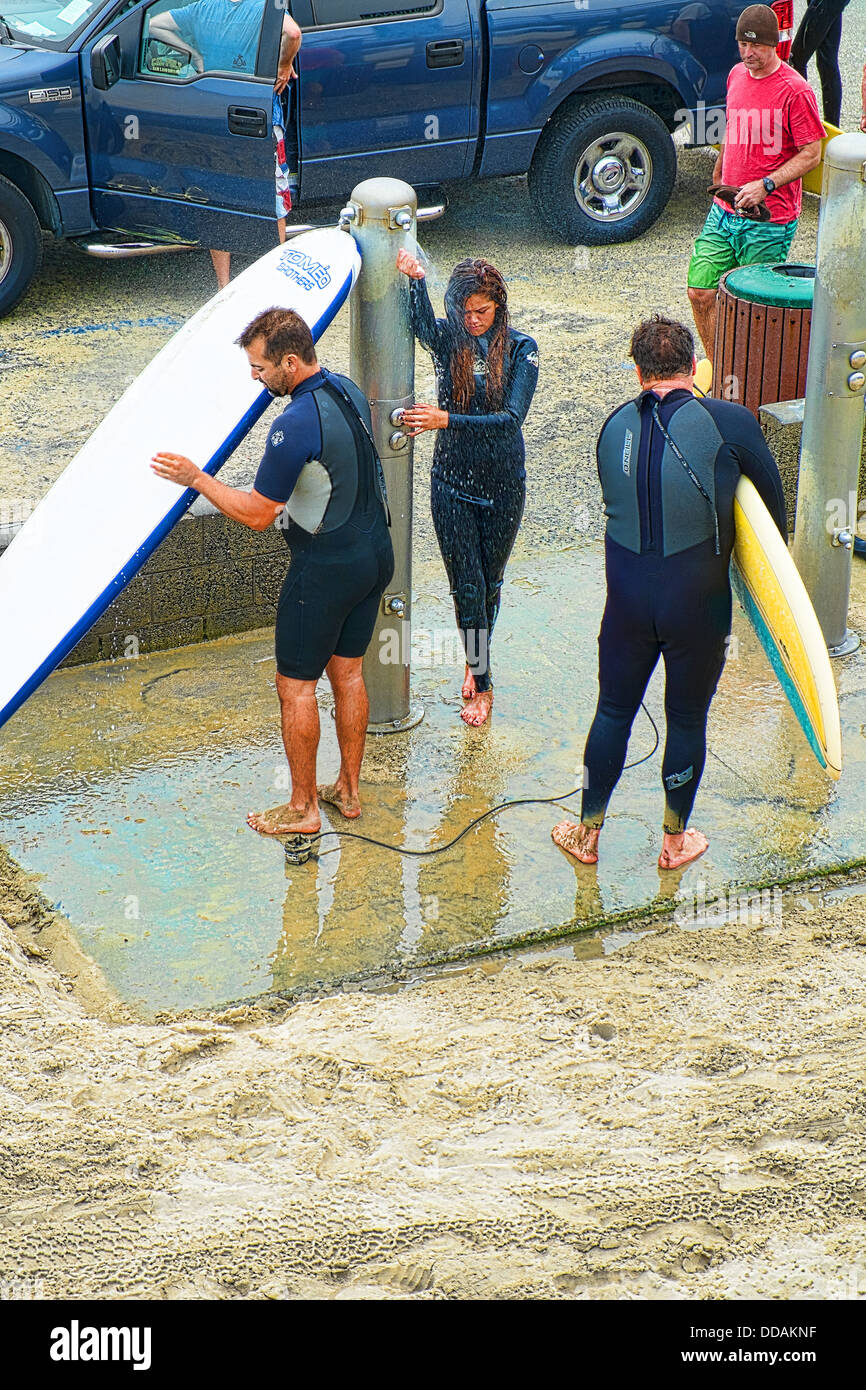 Surfers washing surfboards on Seal Beach CA Stock Photo - Alamy