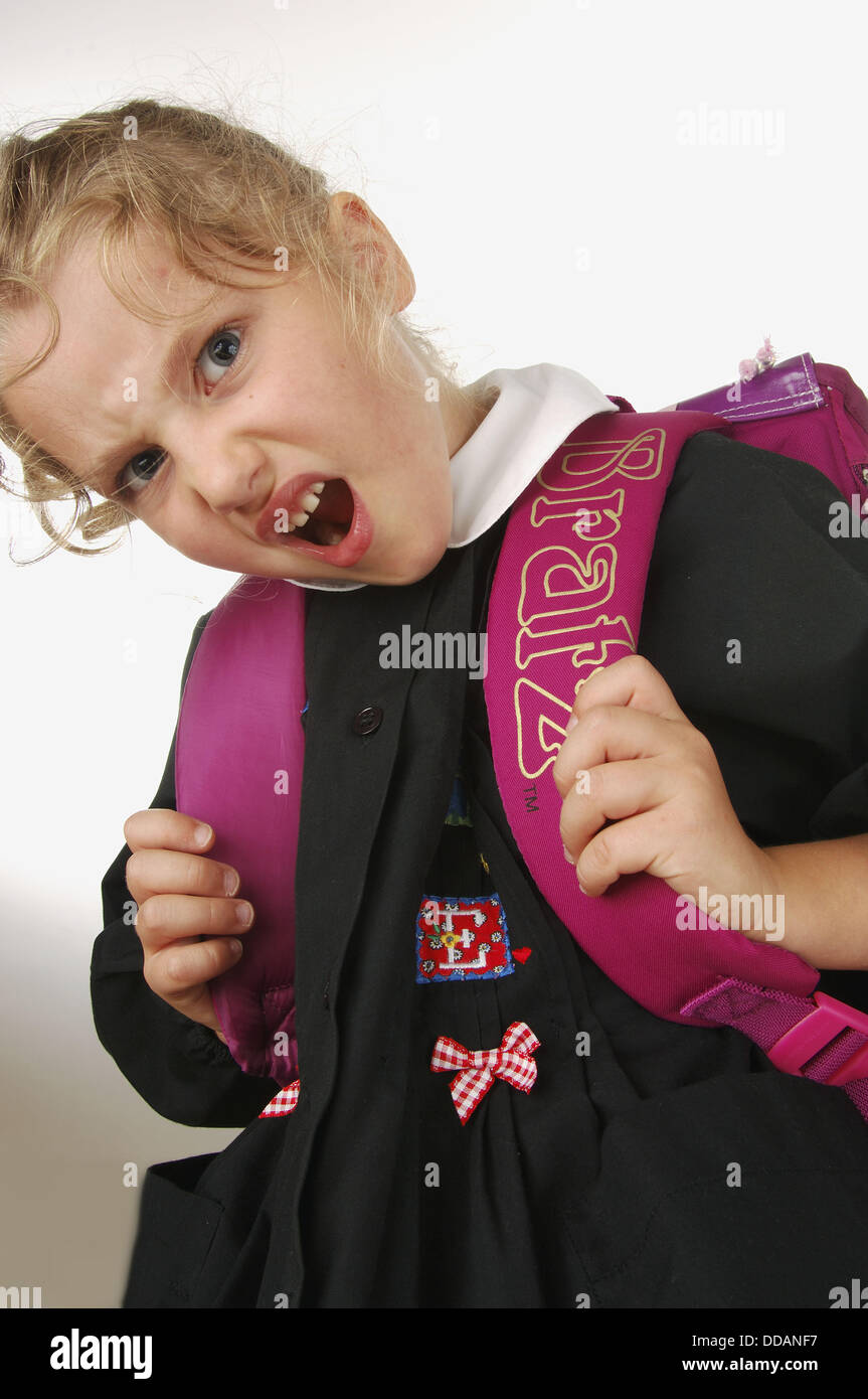 Child goes to school with a too heavy bag Stock Photo - Alamy