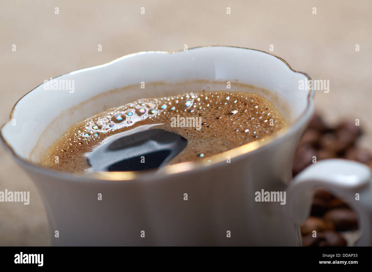 Coffee cup coffee beans background Stock Photo - Alamy