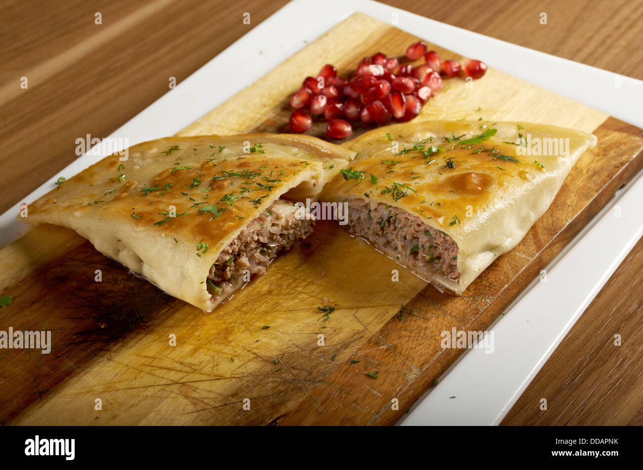 Qutab- baked Chebureki traditional georgian meat pastry.meat in a pitta ...