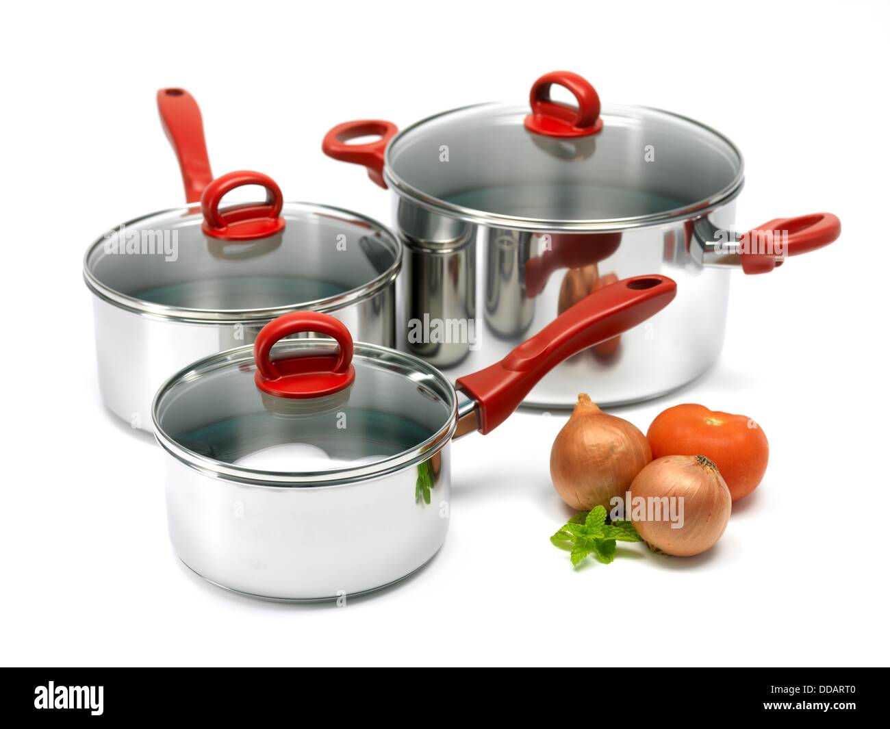 Silver cooking pots isolated against a white background Stock Photo - Alamy