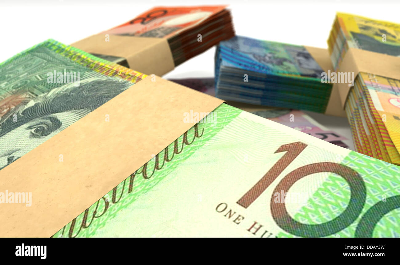 A scattered pile of australian dollar bank notes bundled into value ...