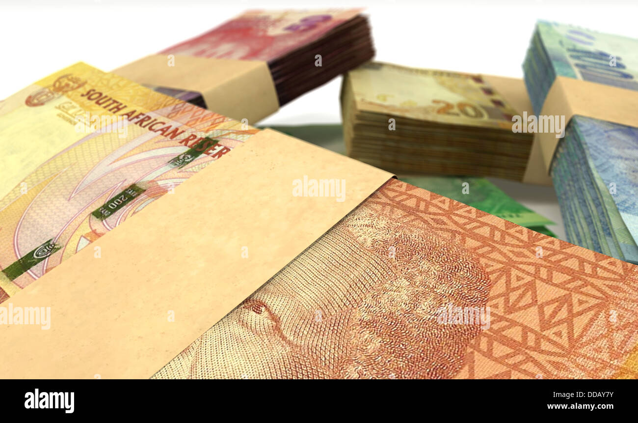 A scattered pile of south african rand bank notes bundled into value ...