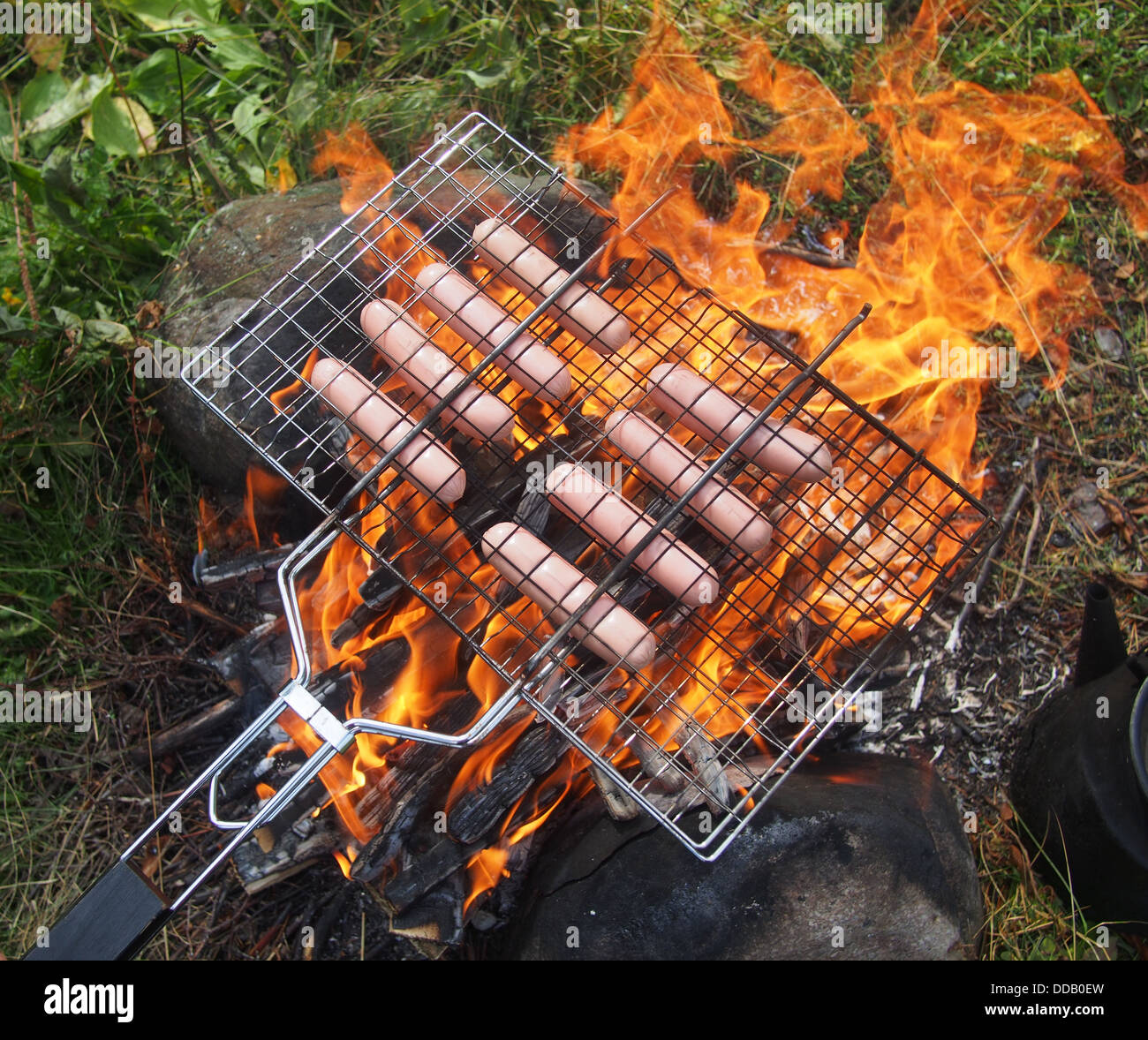 sausages on the fire Stock Photo - Alamy